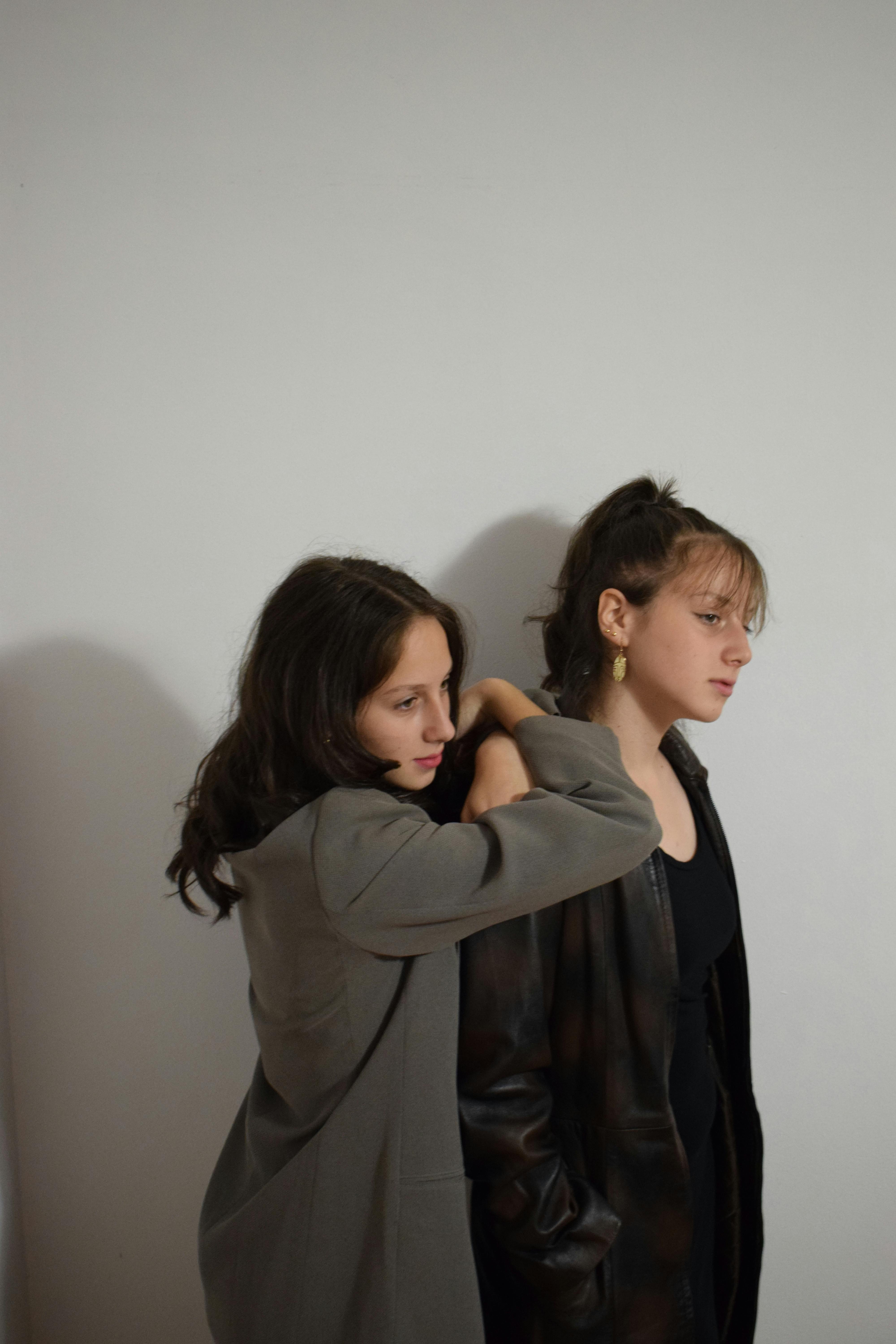 Woman Resting Hands on Friends Shoulder · Free Stock Photo