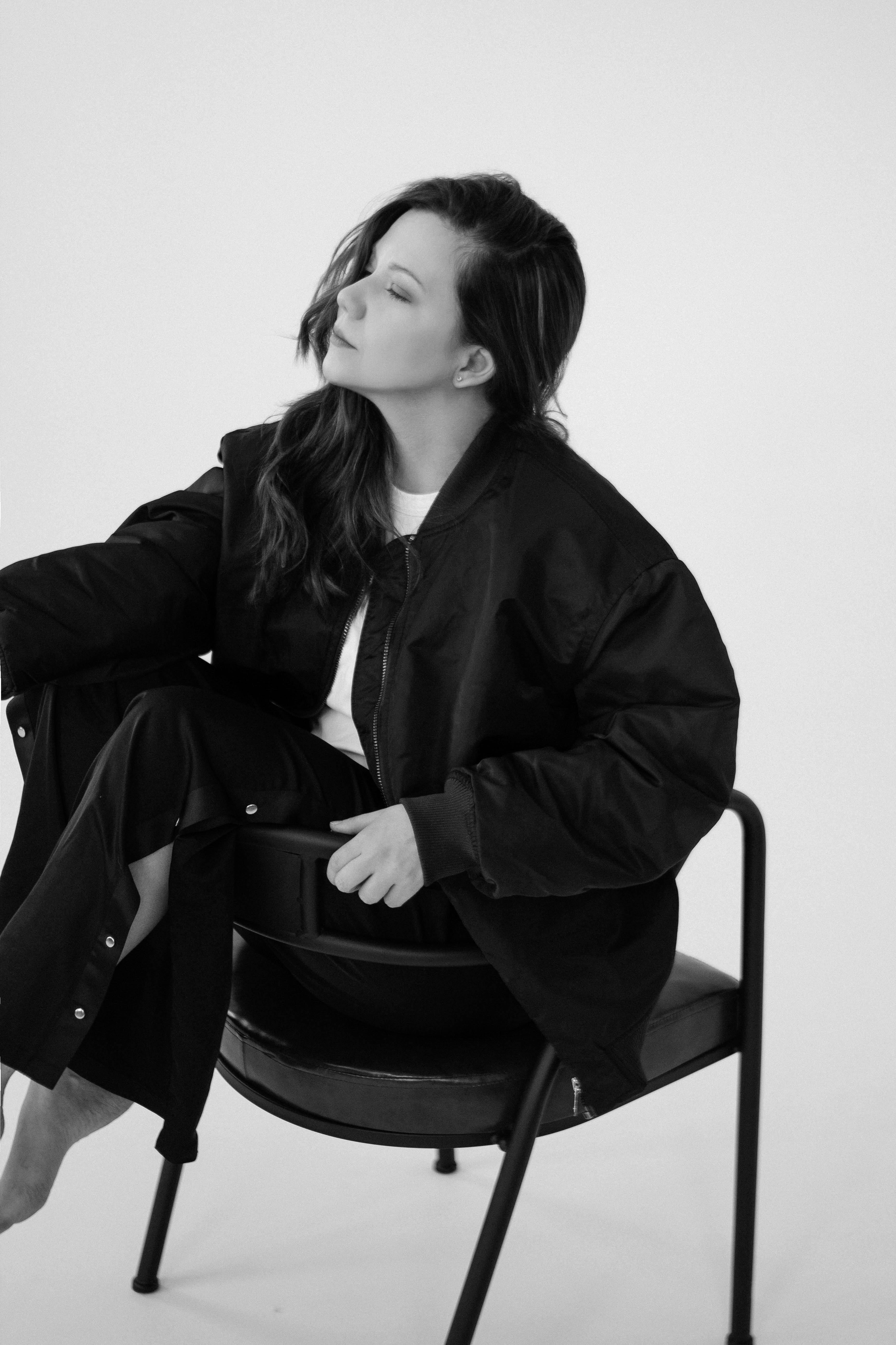 Woman Sitting Backwards on a Chair · Free Stock Photo