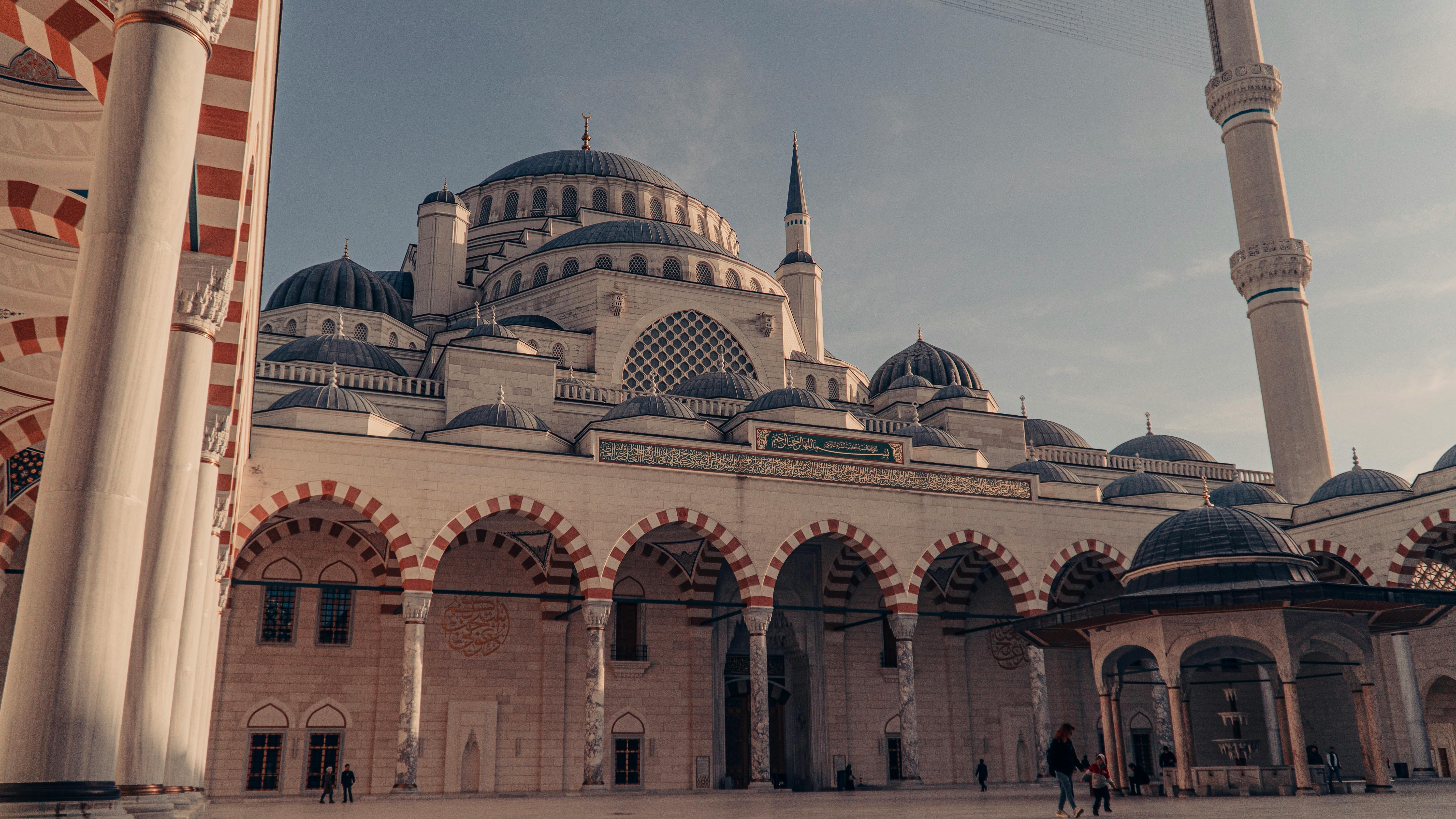 Courtyard and arched passage of medieval mosque · Free Stock Photo