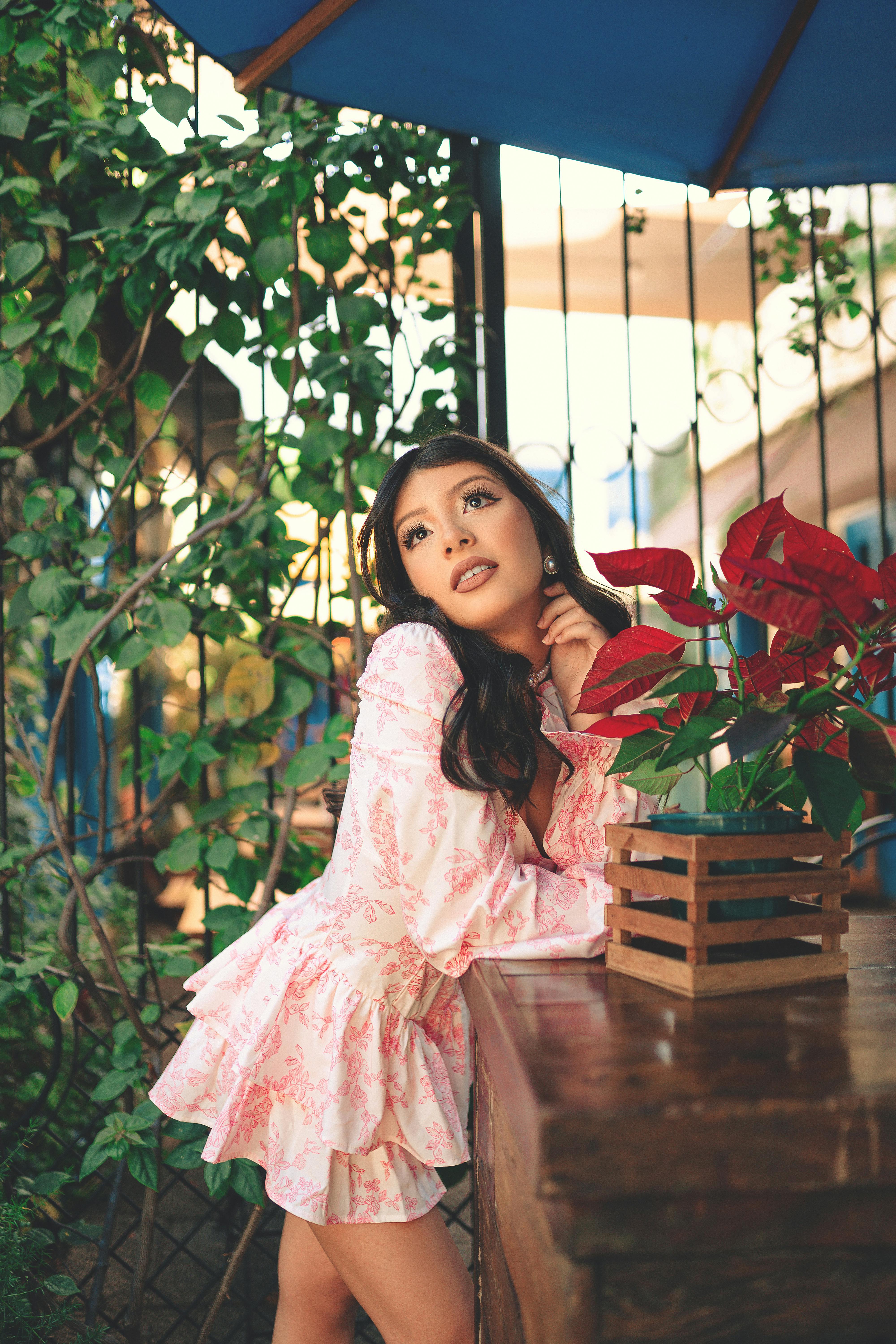 Standing Woman Leaning on Counter · Free Stock Photo