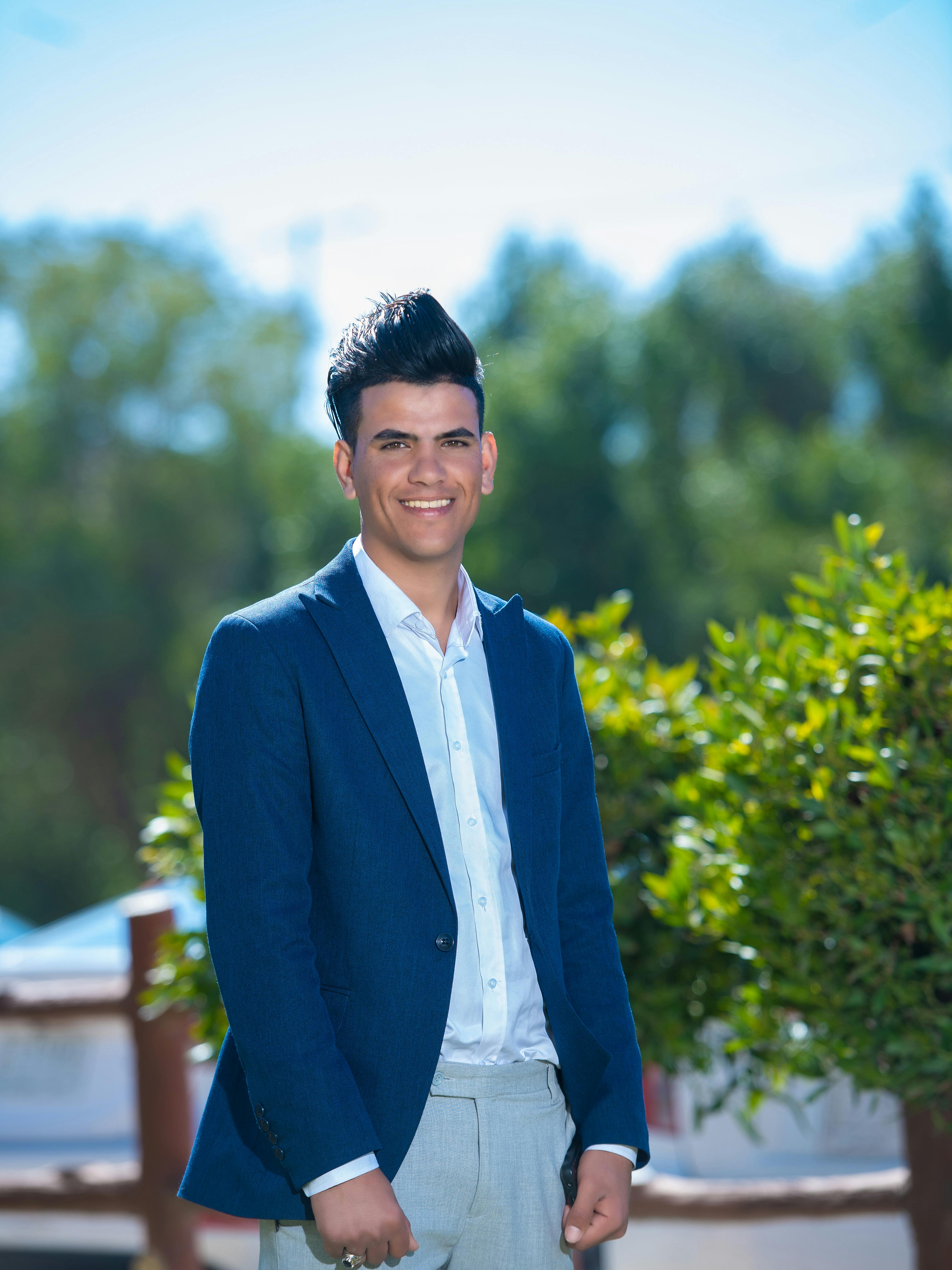 Smiling Young Man in Suit Posing on White Studio Background · Free ...