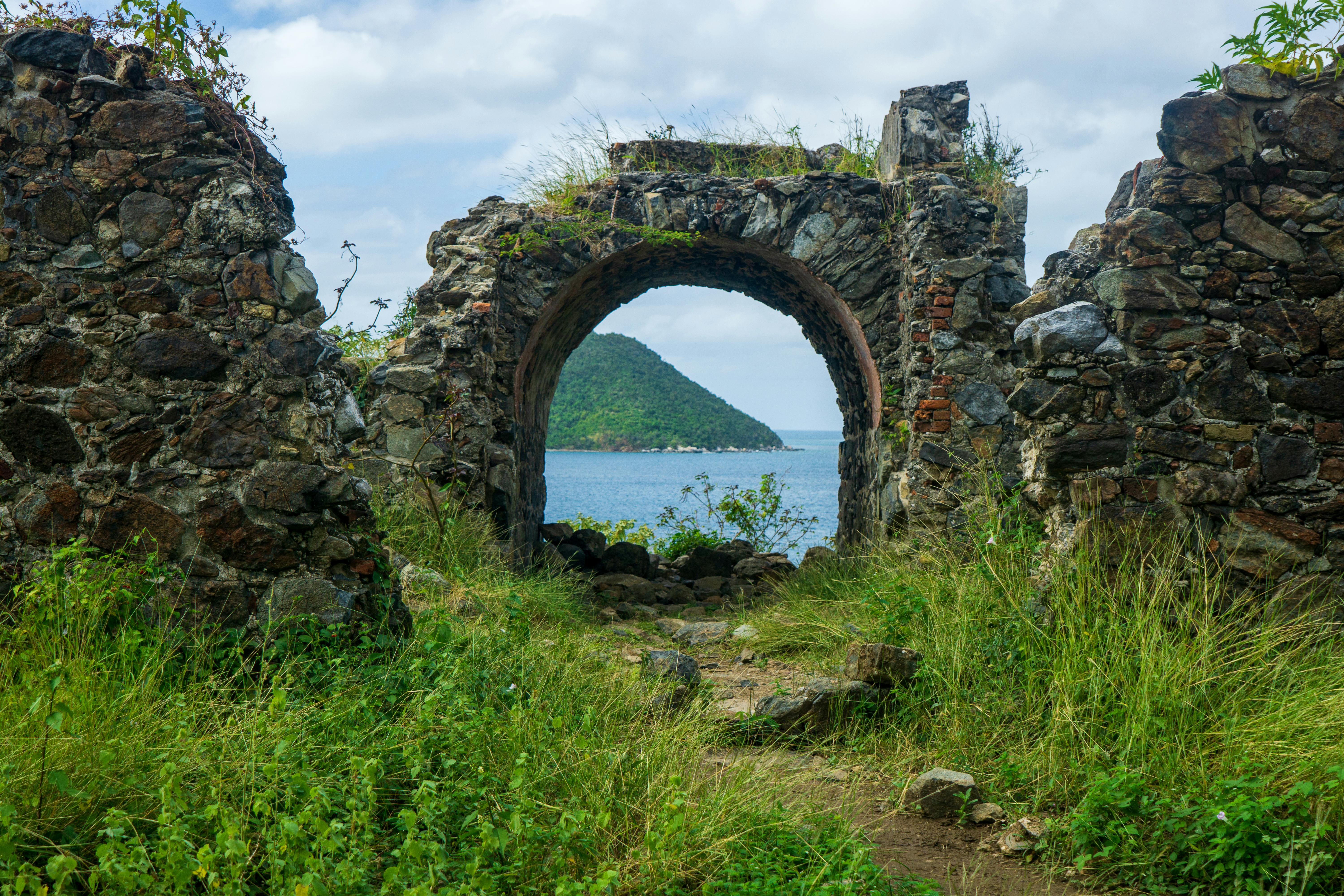 Ruins of Stone Walls and Gate on Shore · Free Stock Photo