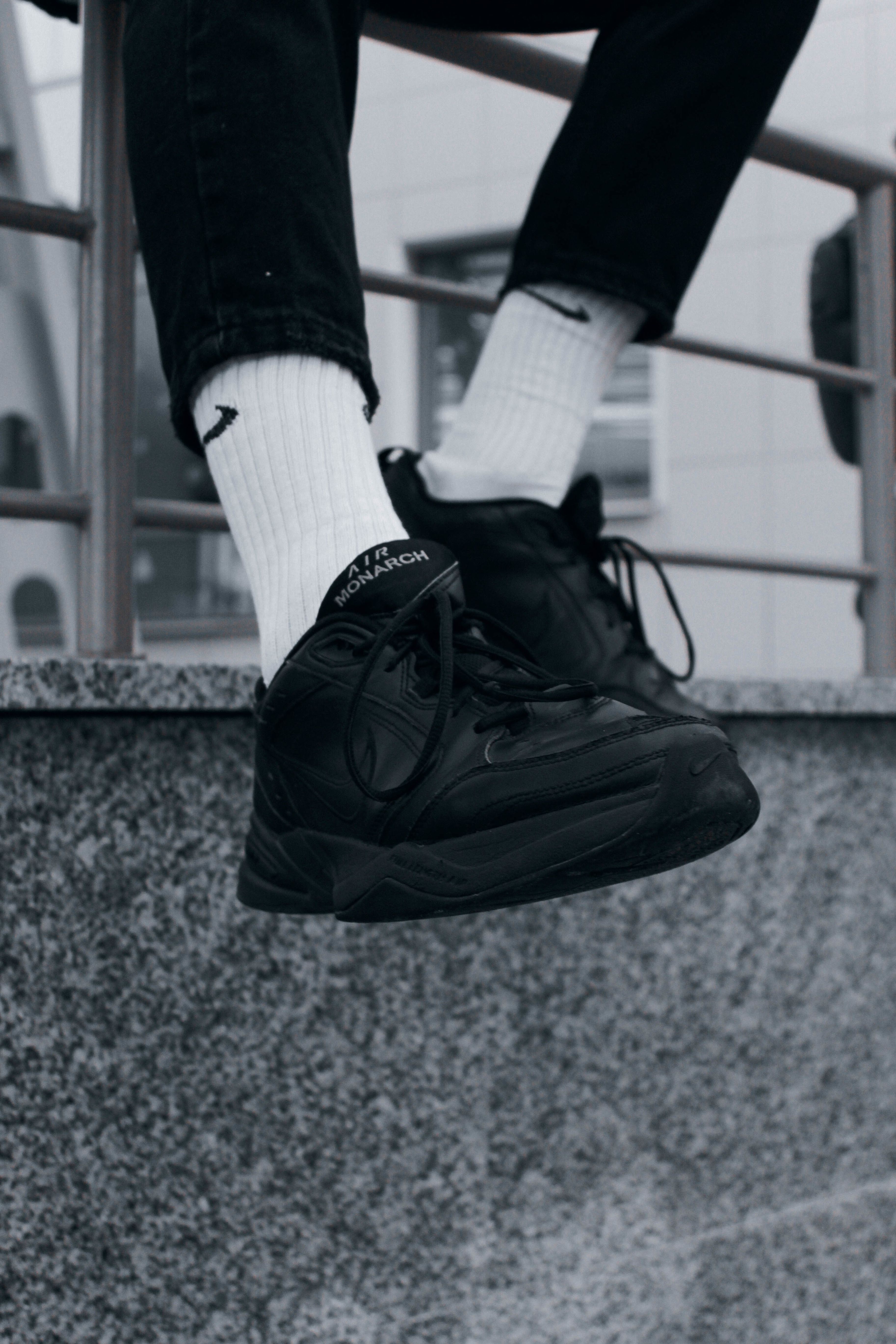 Nike Dunk High Retro Shoes with Black Nike Socks on Legs · Free Stock Photo