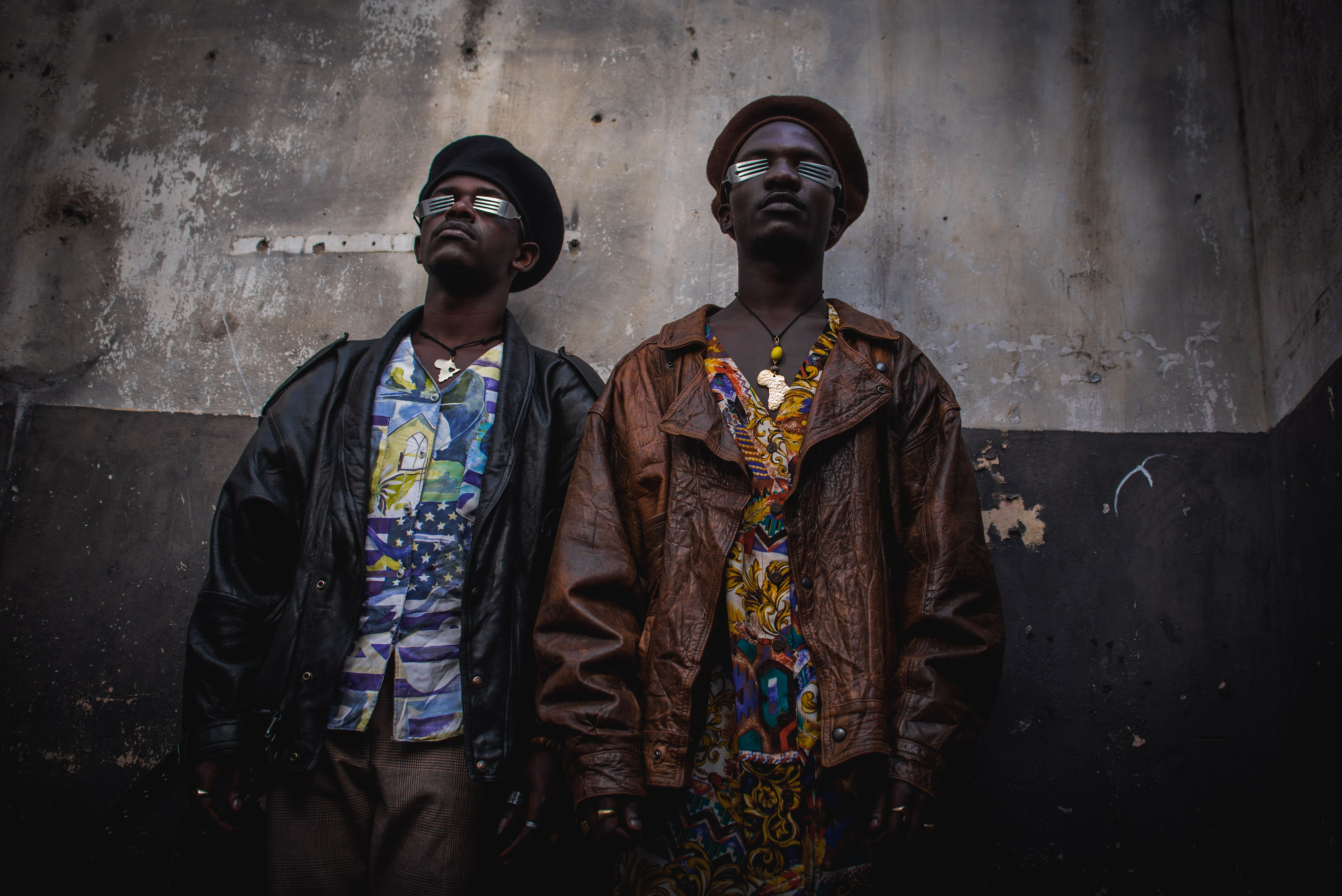 Two men in leather jackets and hats standing next to each other · Free ...