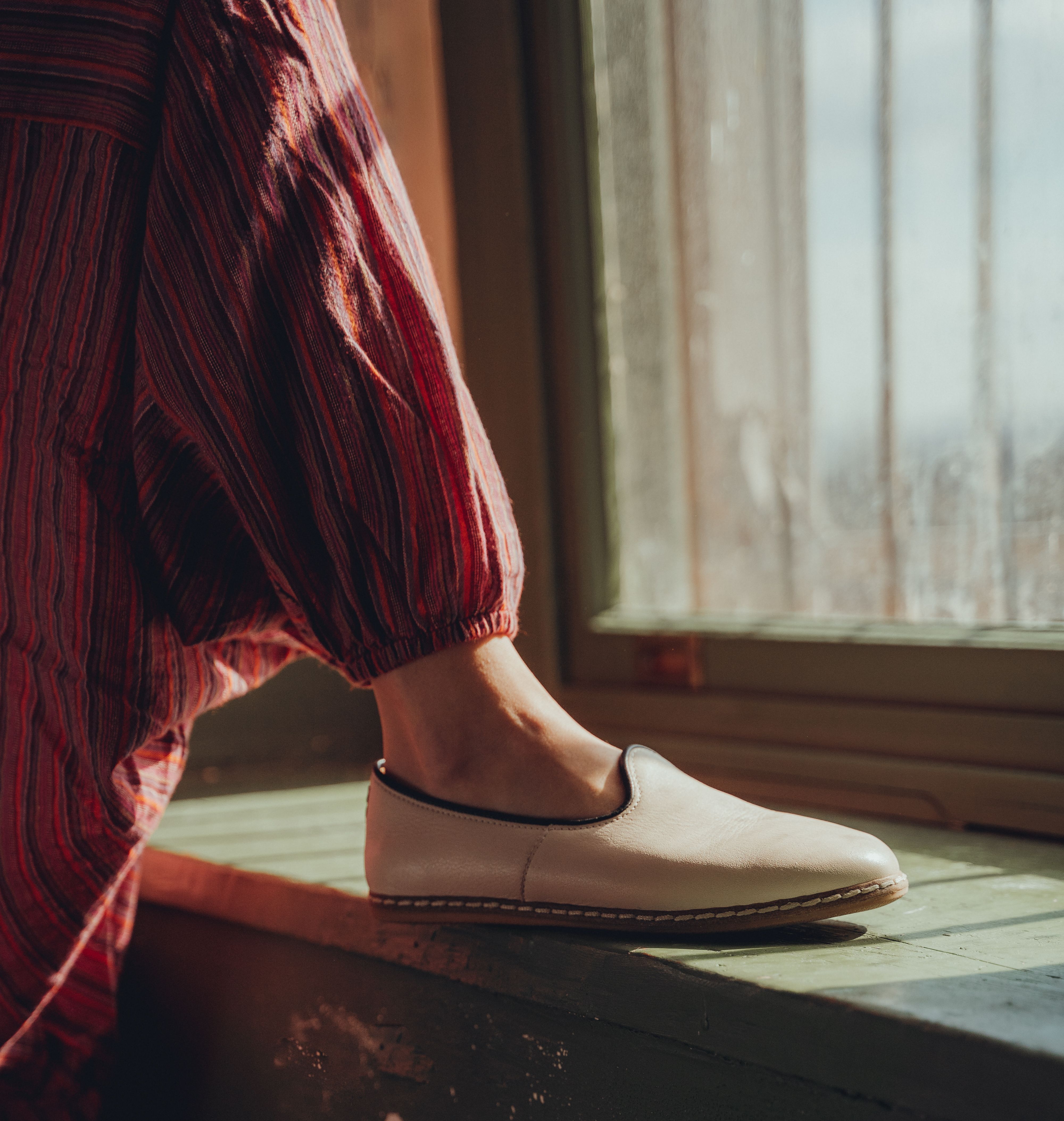 Woman Leg in Shoe on Windowsill · Free Stock Photo