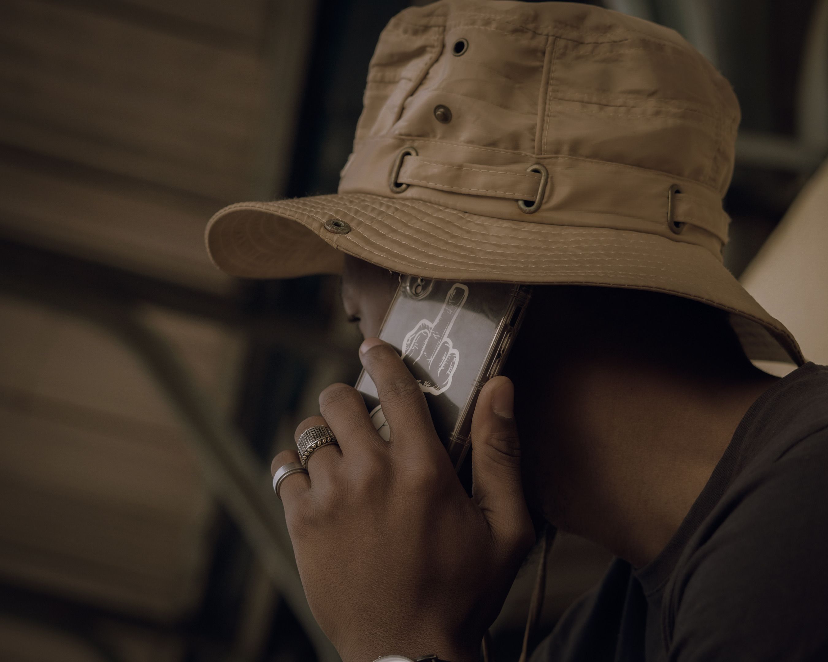 Close-up of Man in Panama Talking on Cellphone · Free Stock Photo