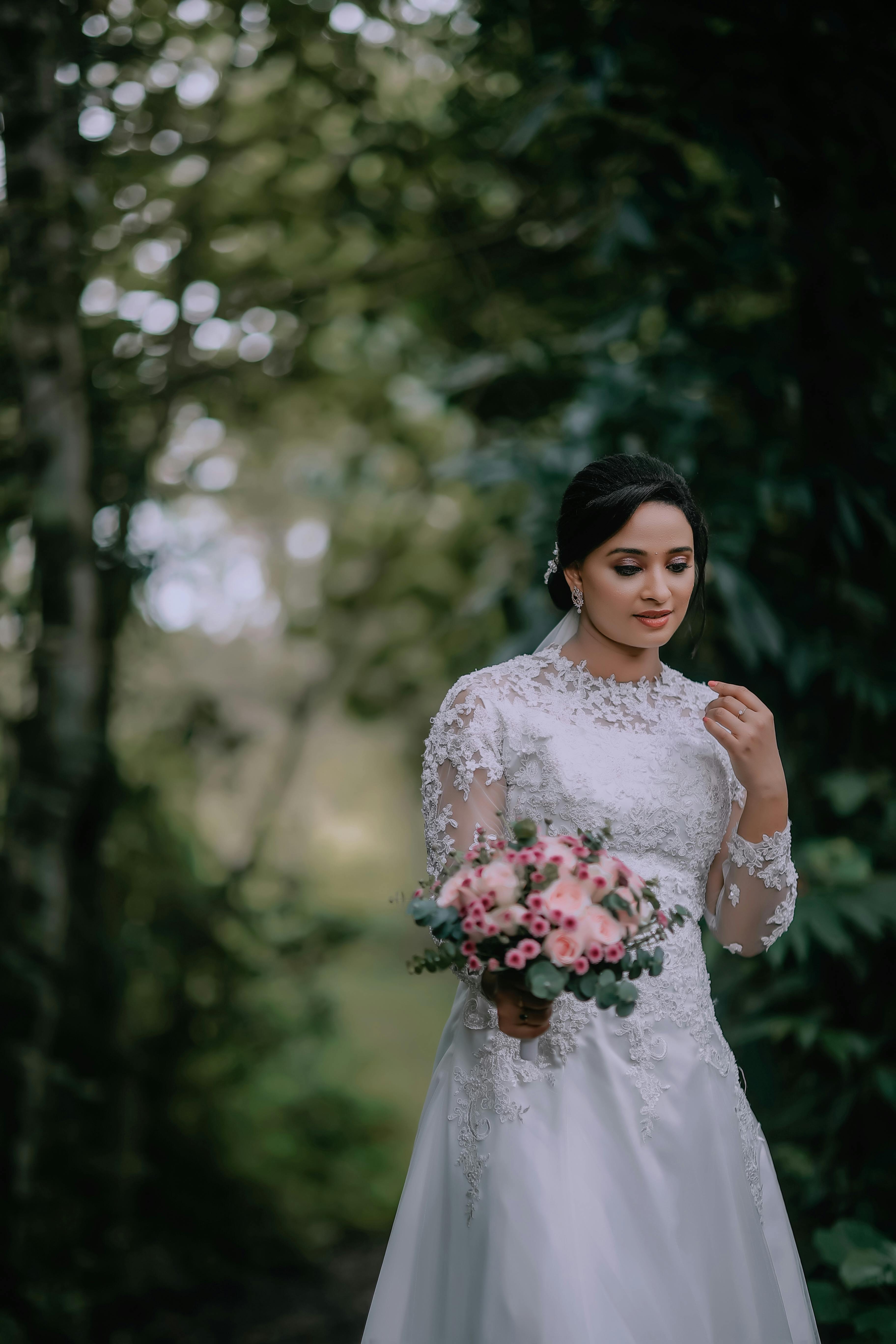 Back View of a Bride Sitting in front of a Building · Free Stock Photo