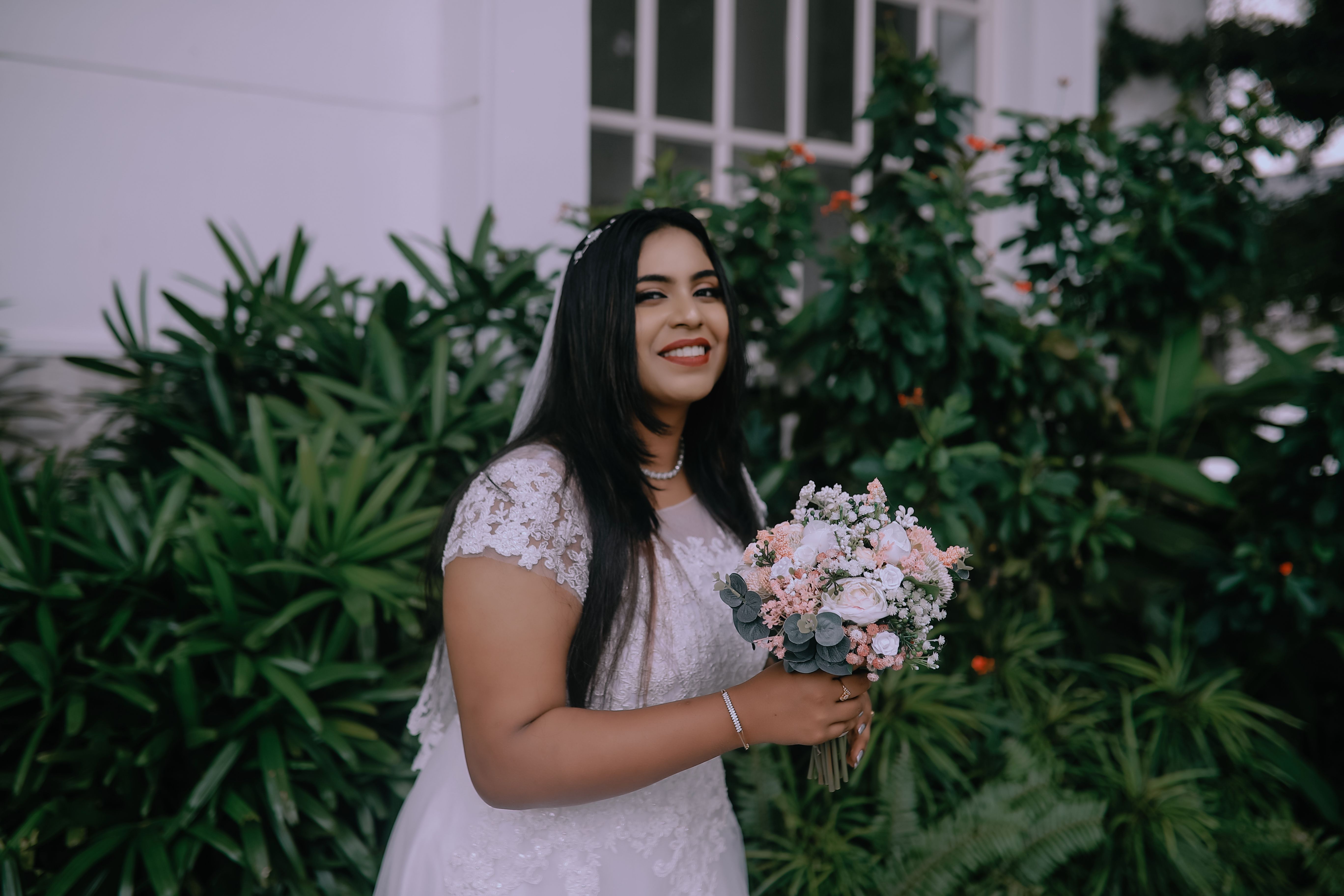 Woman in Wedding Dress Standing in Sunlight · Free Stock Photo