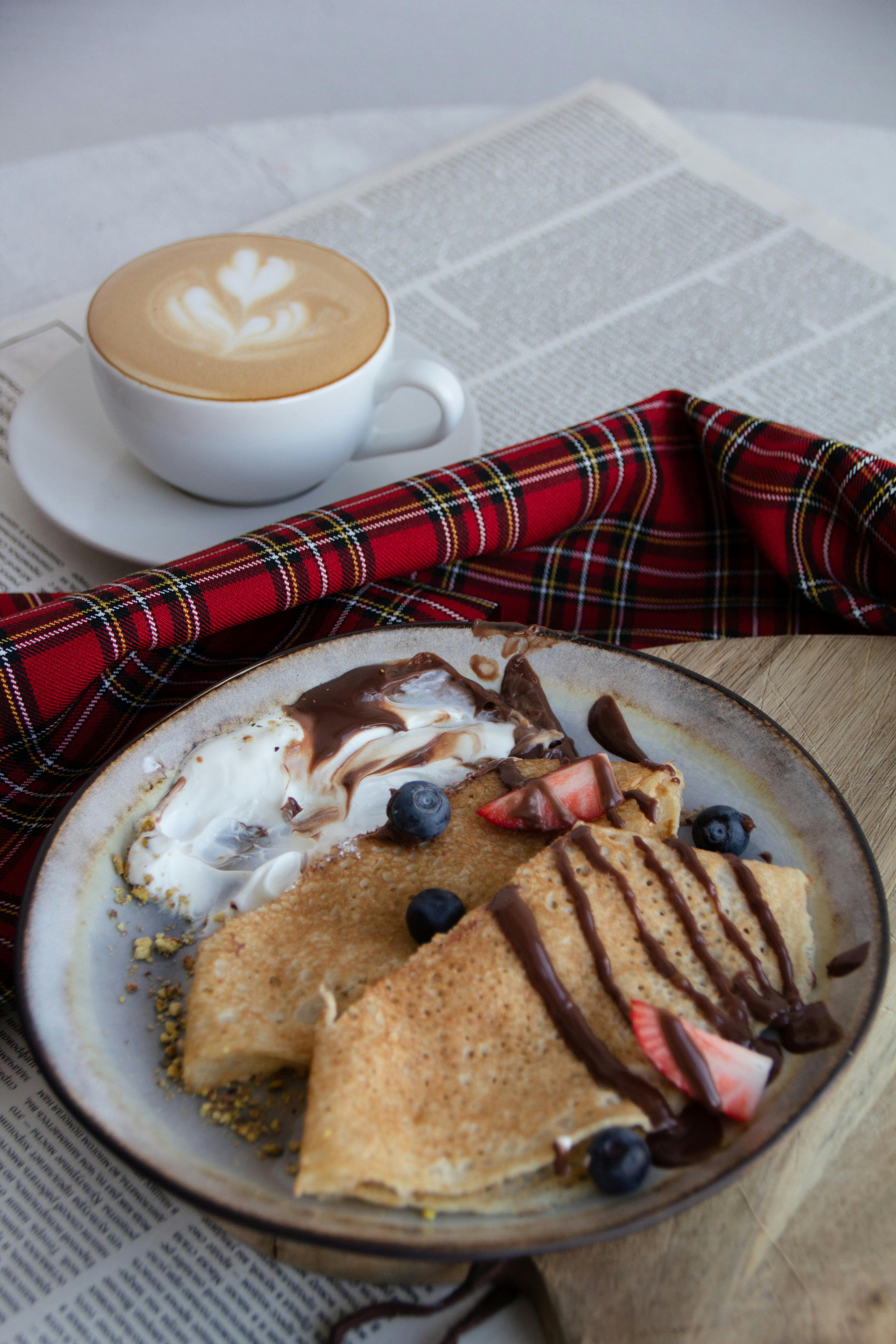 Man and Woman Eating Under Kitchen Table · Free Stock Photo