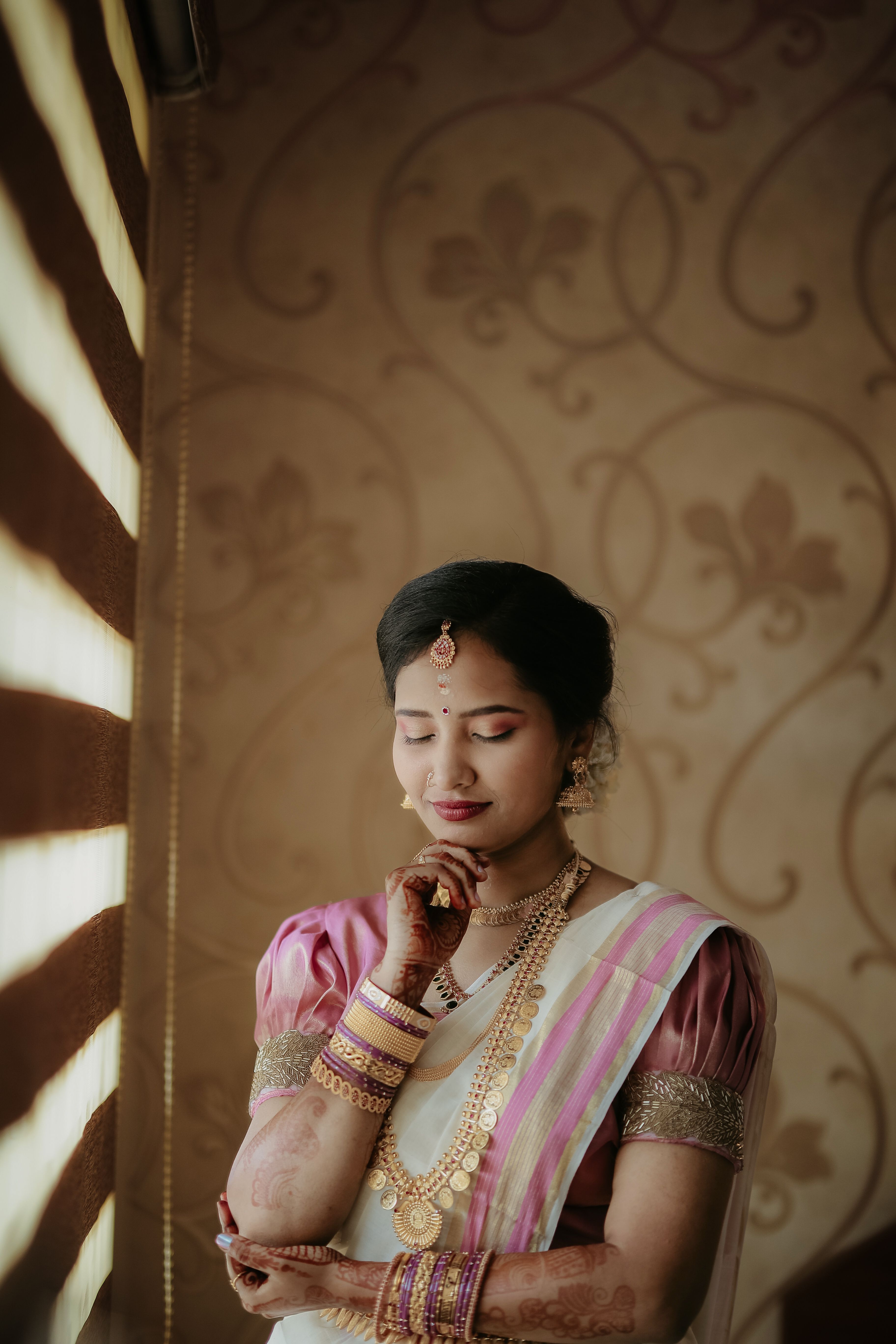 Unwrapped Sari Flying behind Woman Standing on Bridge · Free Stock Photo