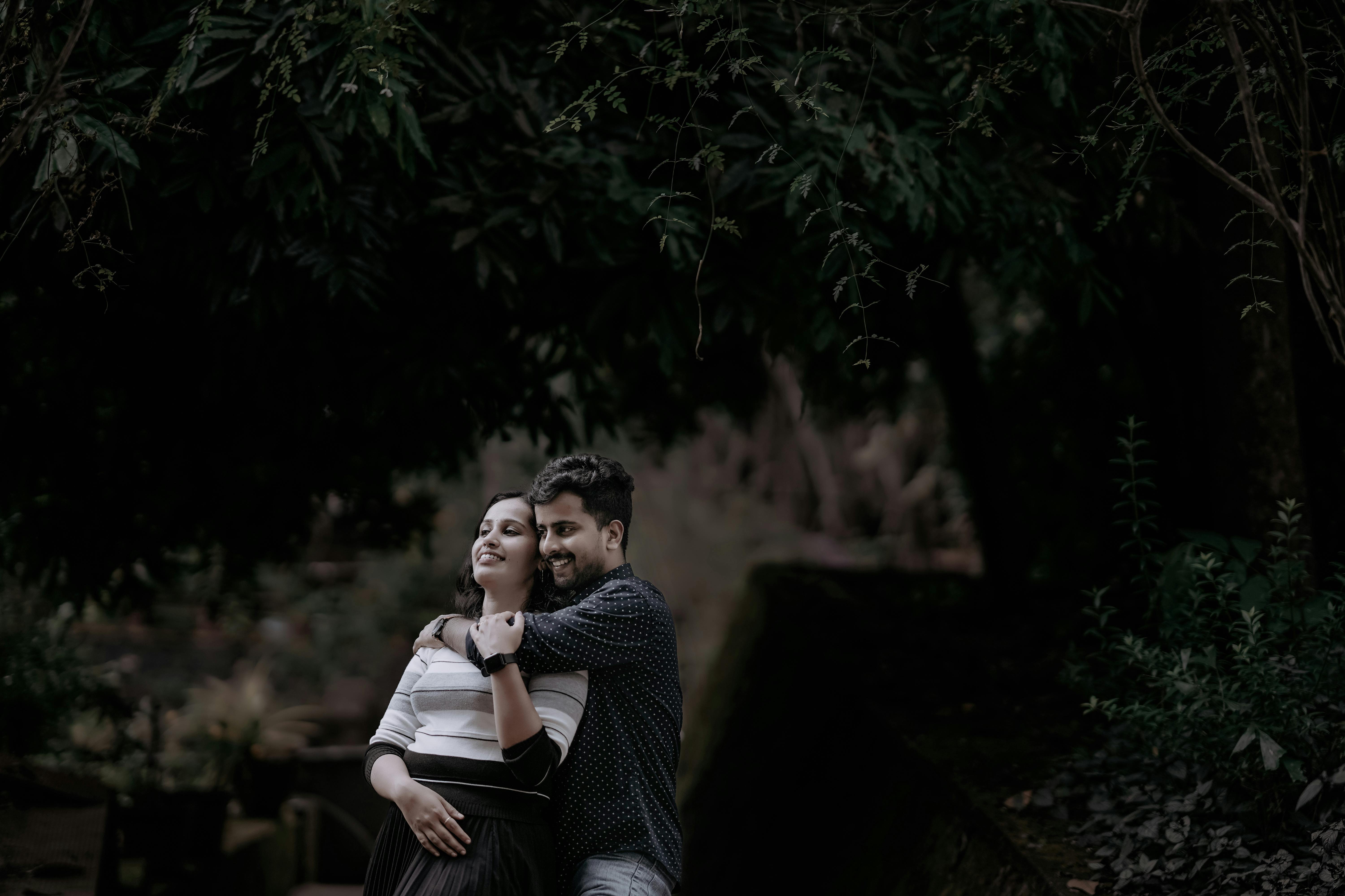 Young Couple Standing Face to Face and Embracing · Free Stock Photo