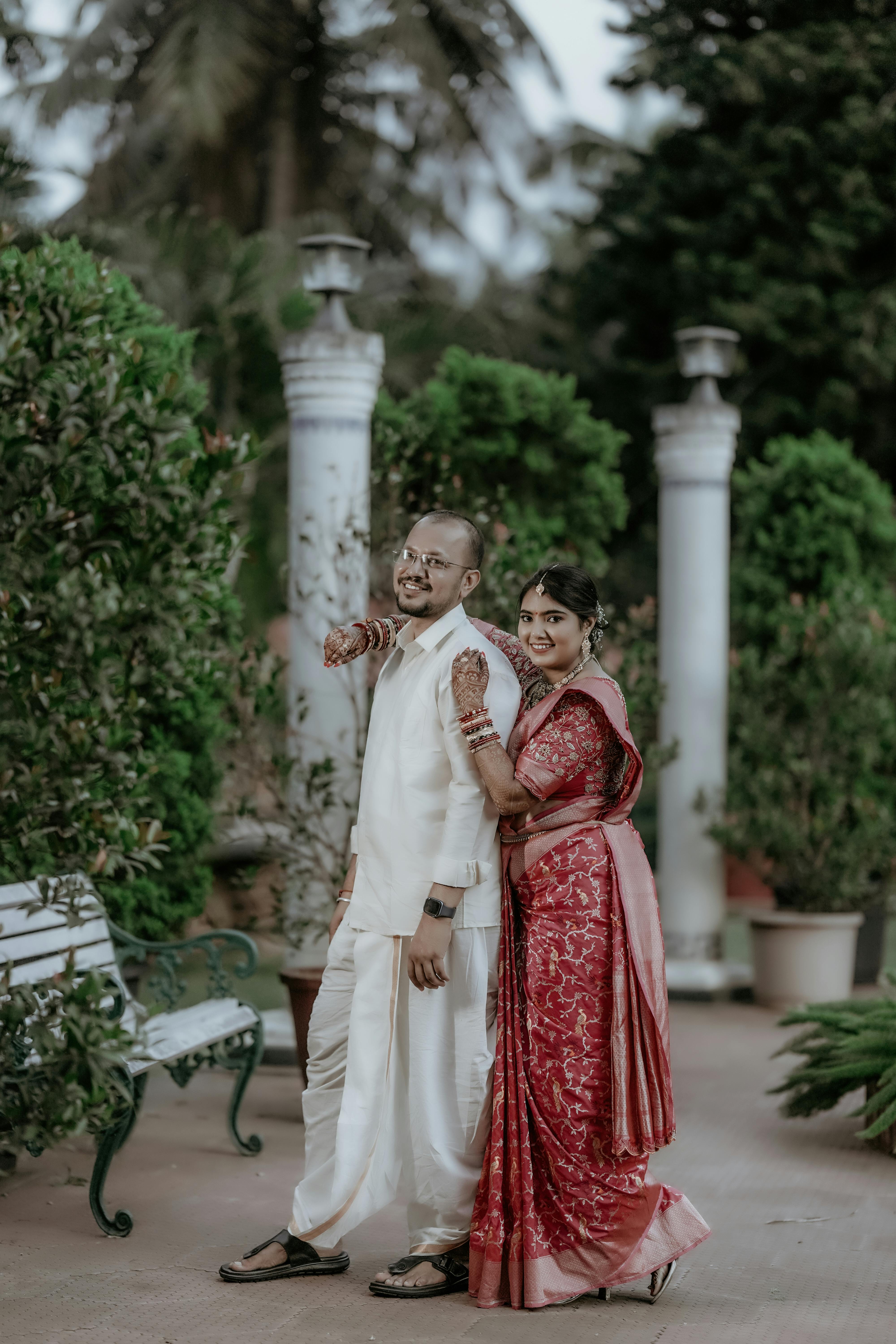 Hindu Bride and Groom Standing in front of a Temple · Free Stock Photo