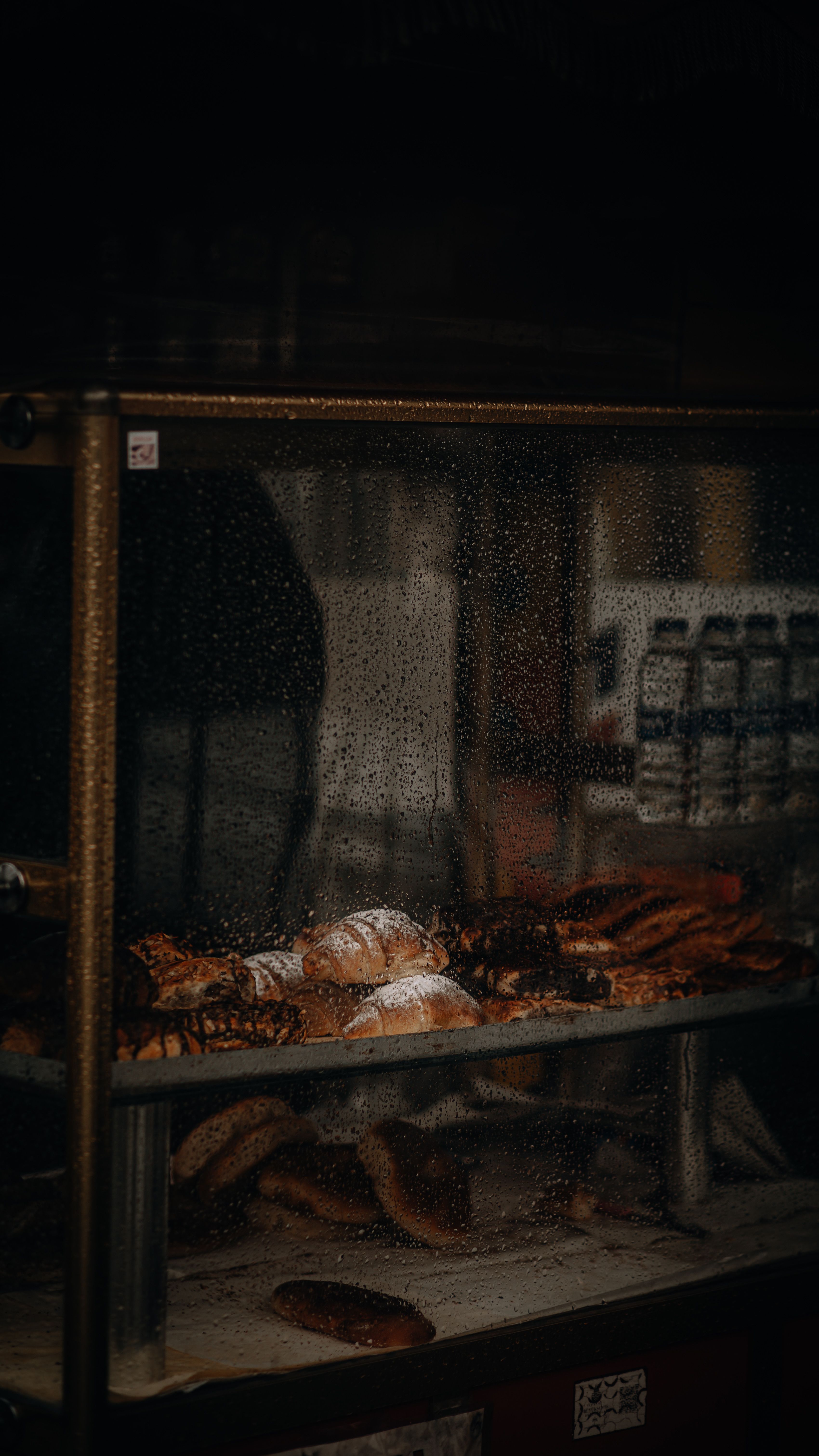 Pastry in Bakery Showcase in Dark · Free Stock Photo