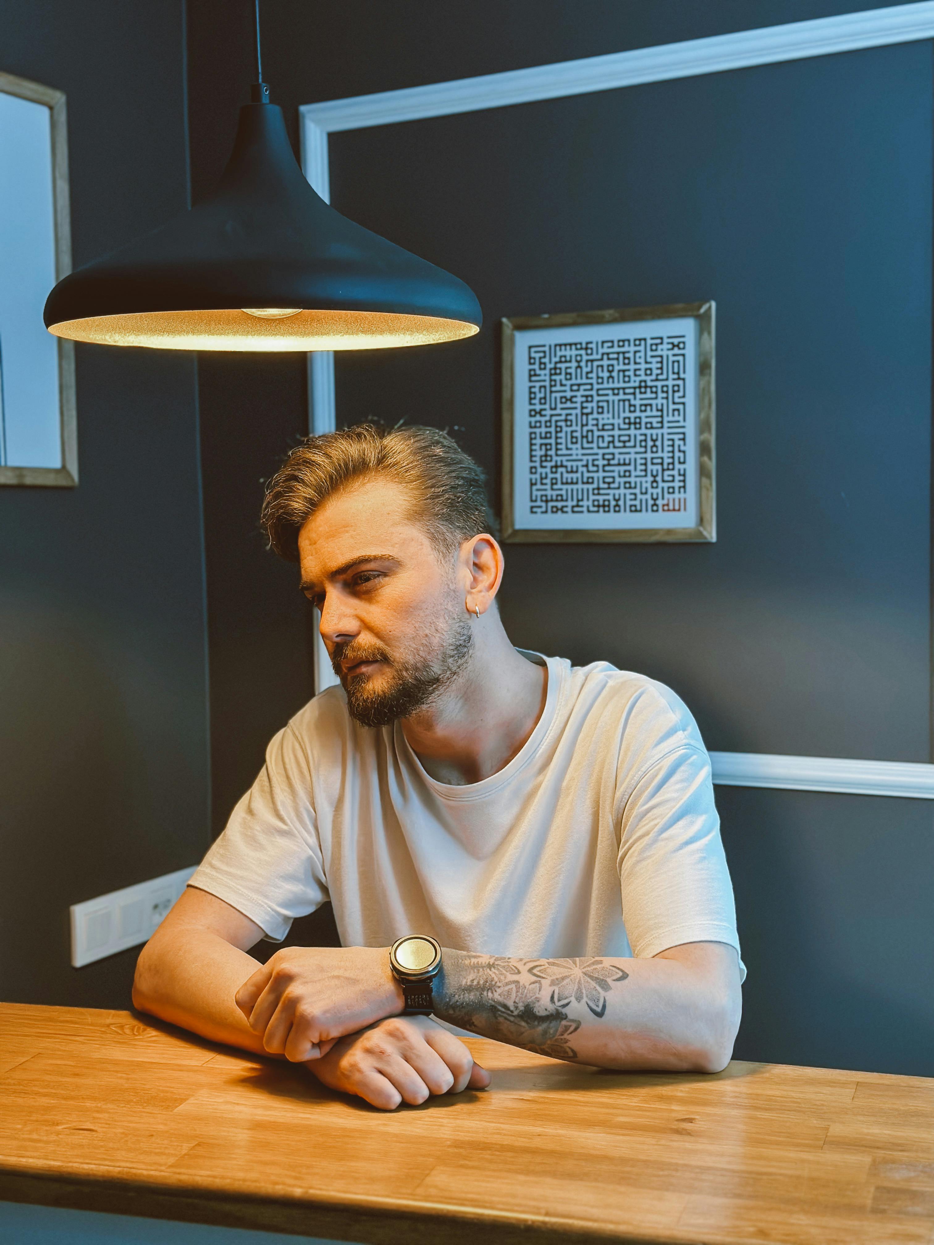 Man Standing by Counter · Free Stock Photo