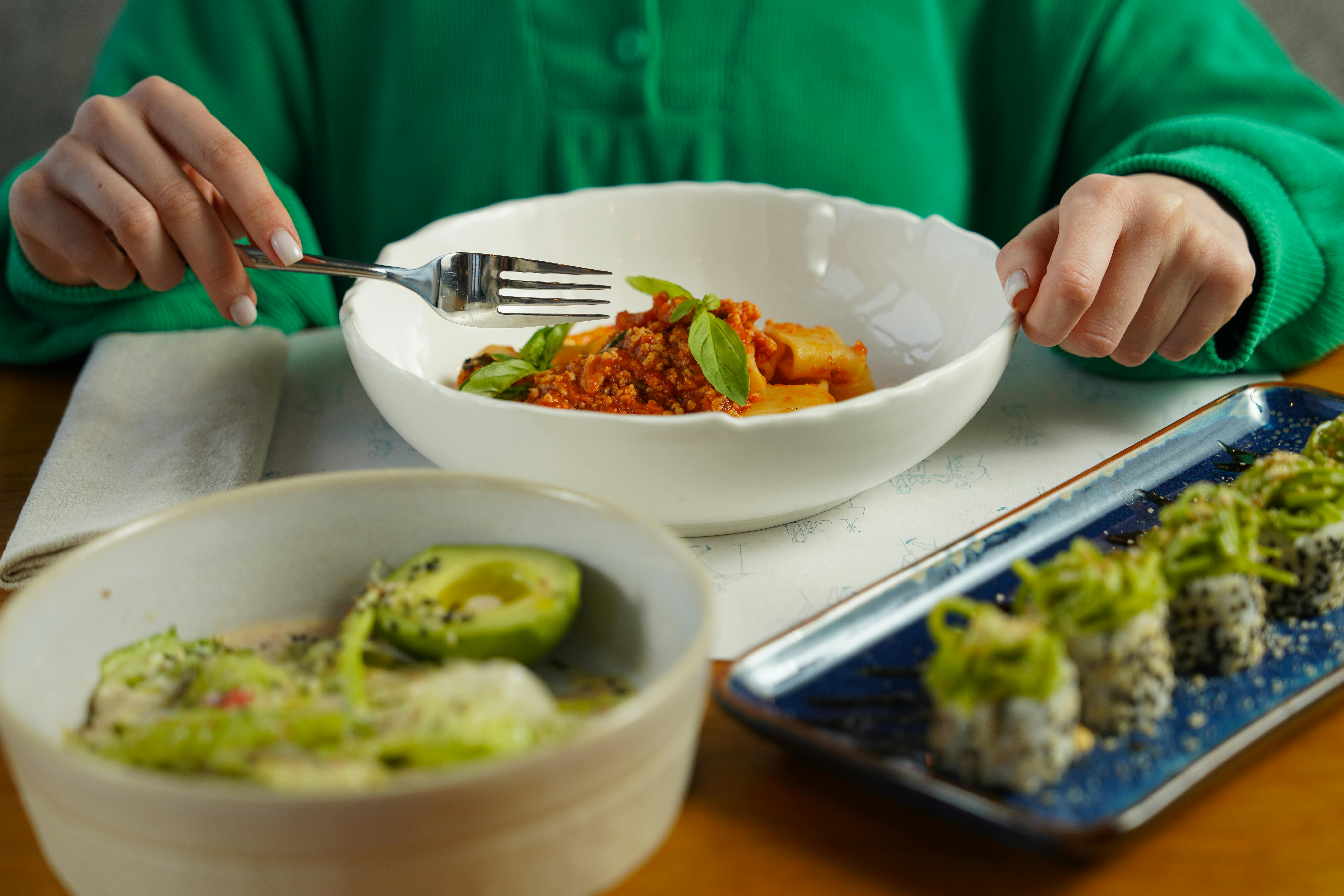 A Person Eating in a Restaurant · Free Stock Photo