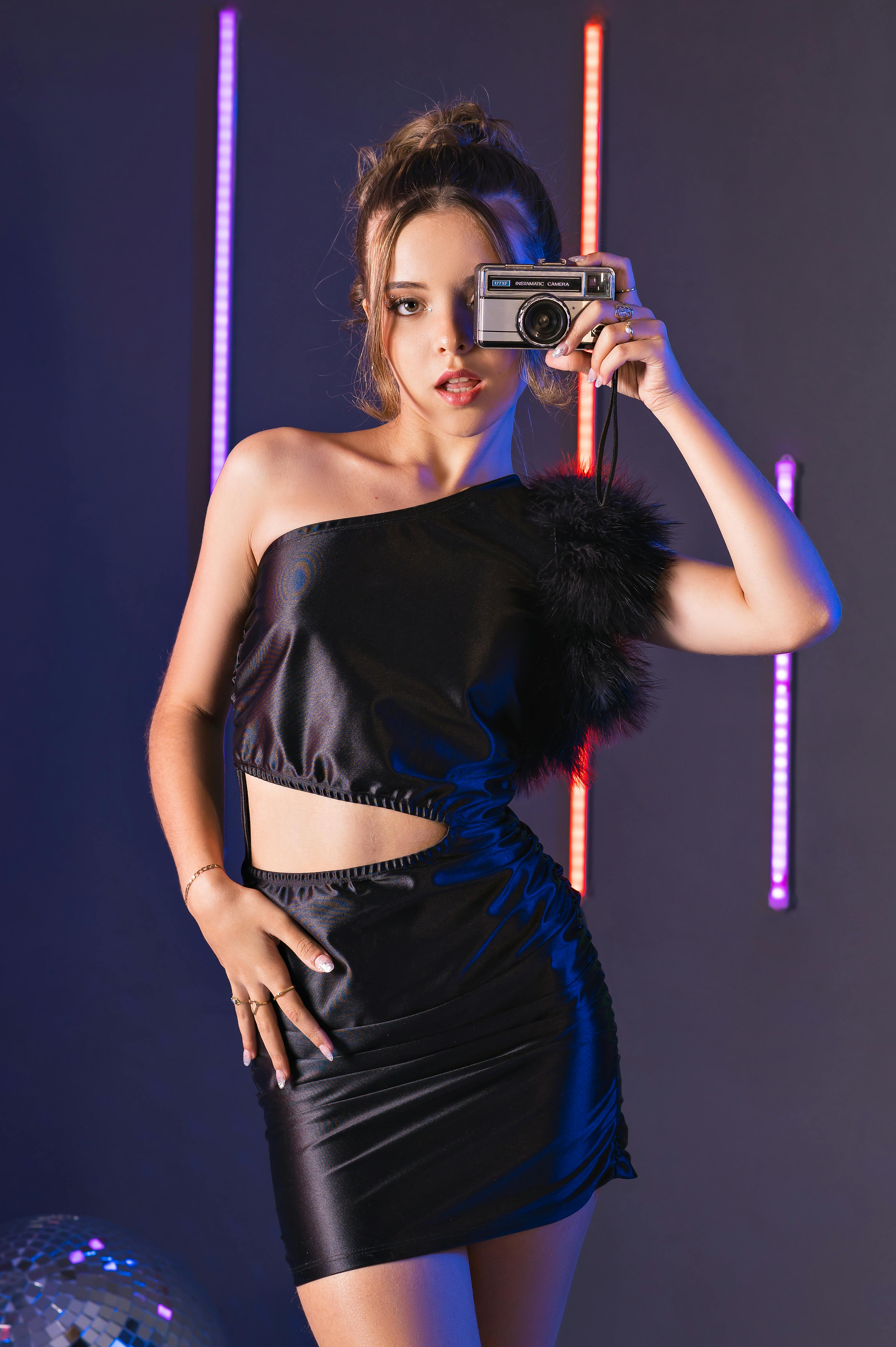 Young Model Taking a Picture with Vintage Camera · Free Stock Photo