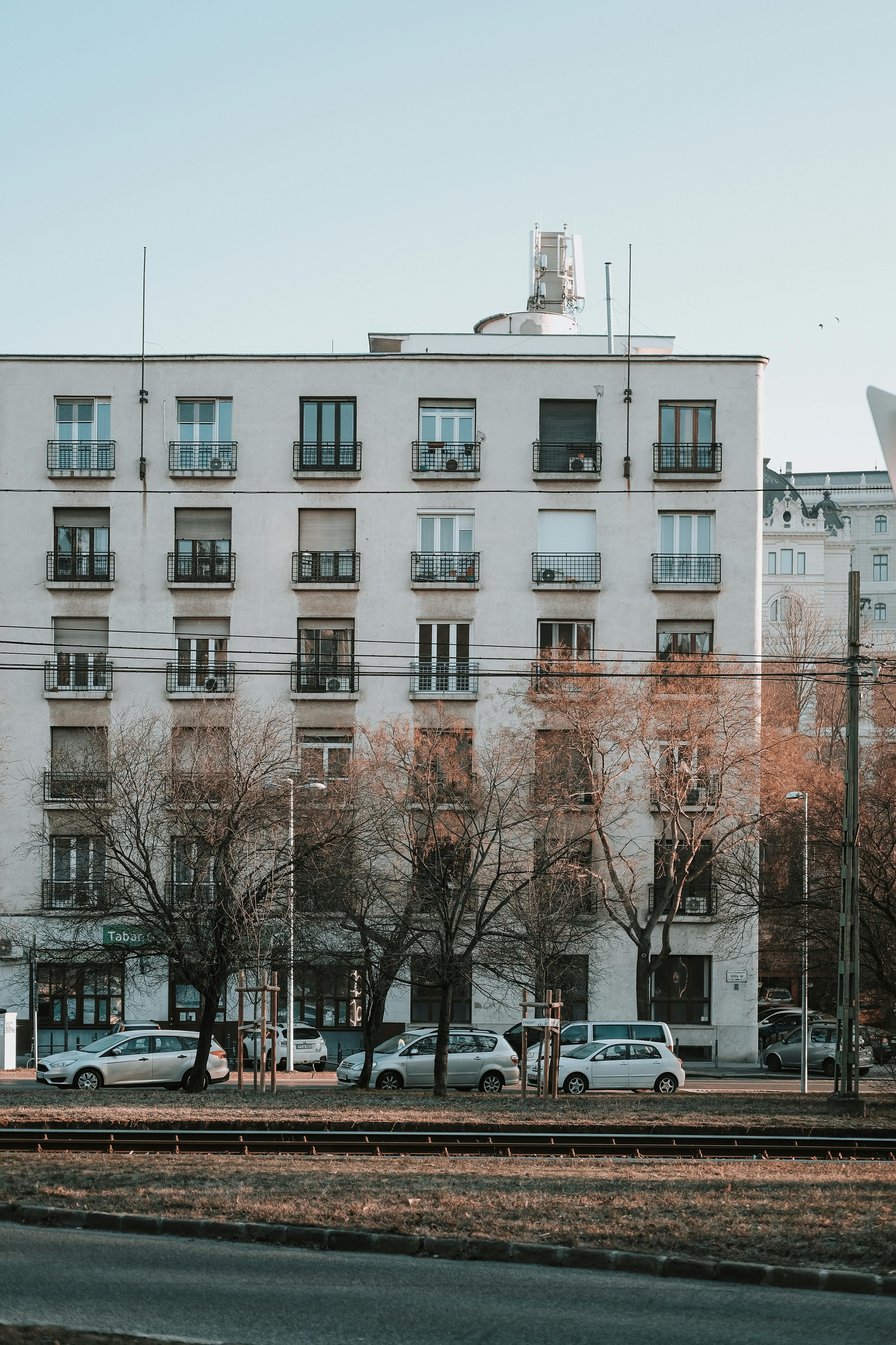 A building with a white roof and a street in the background · Free ...