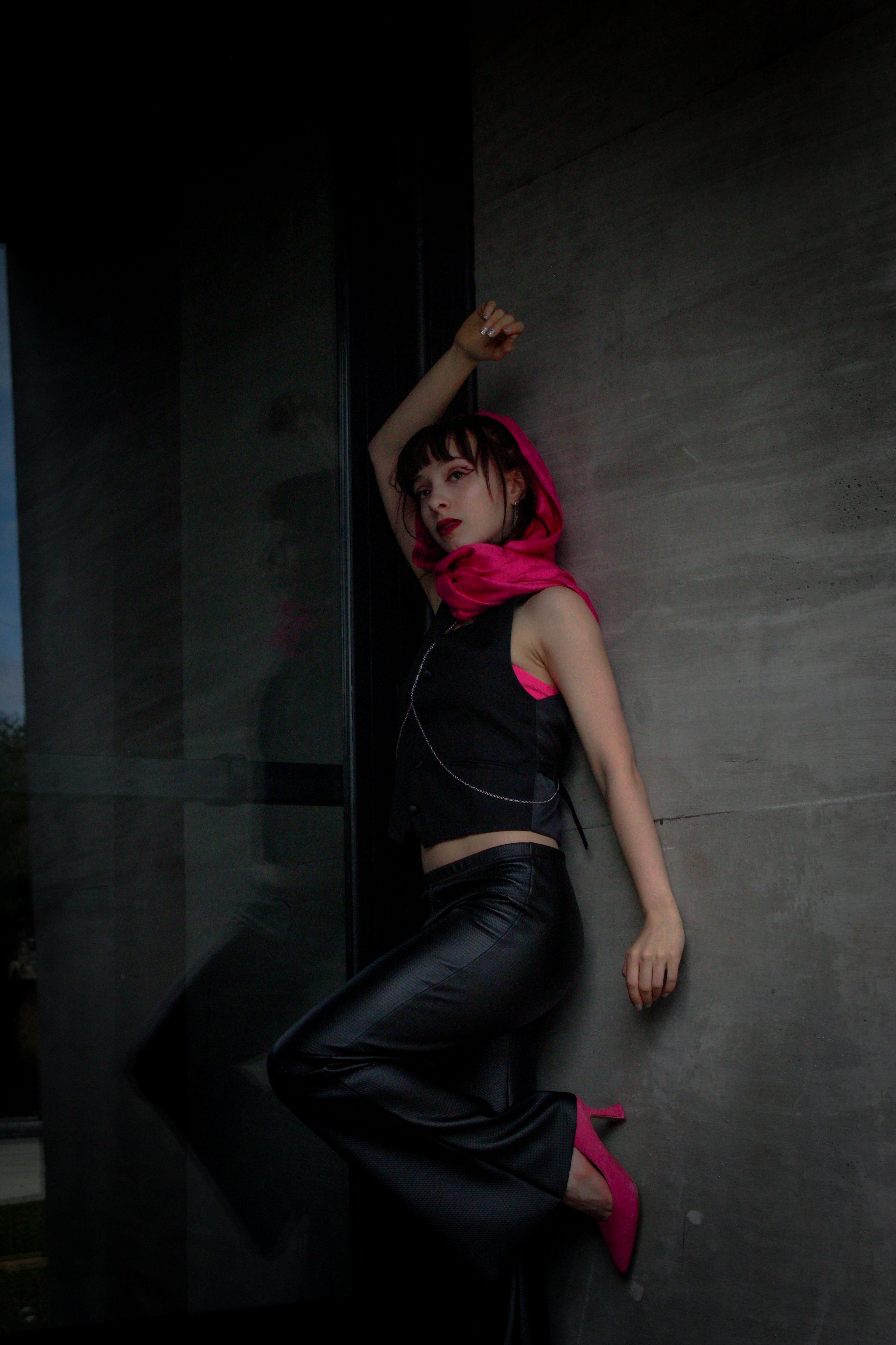 Model Posing in Black Pants and Pink Pumps · Free Stock Photo