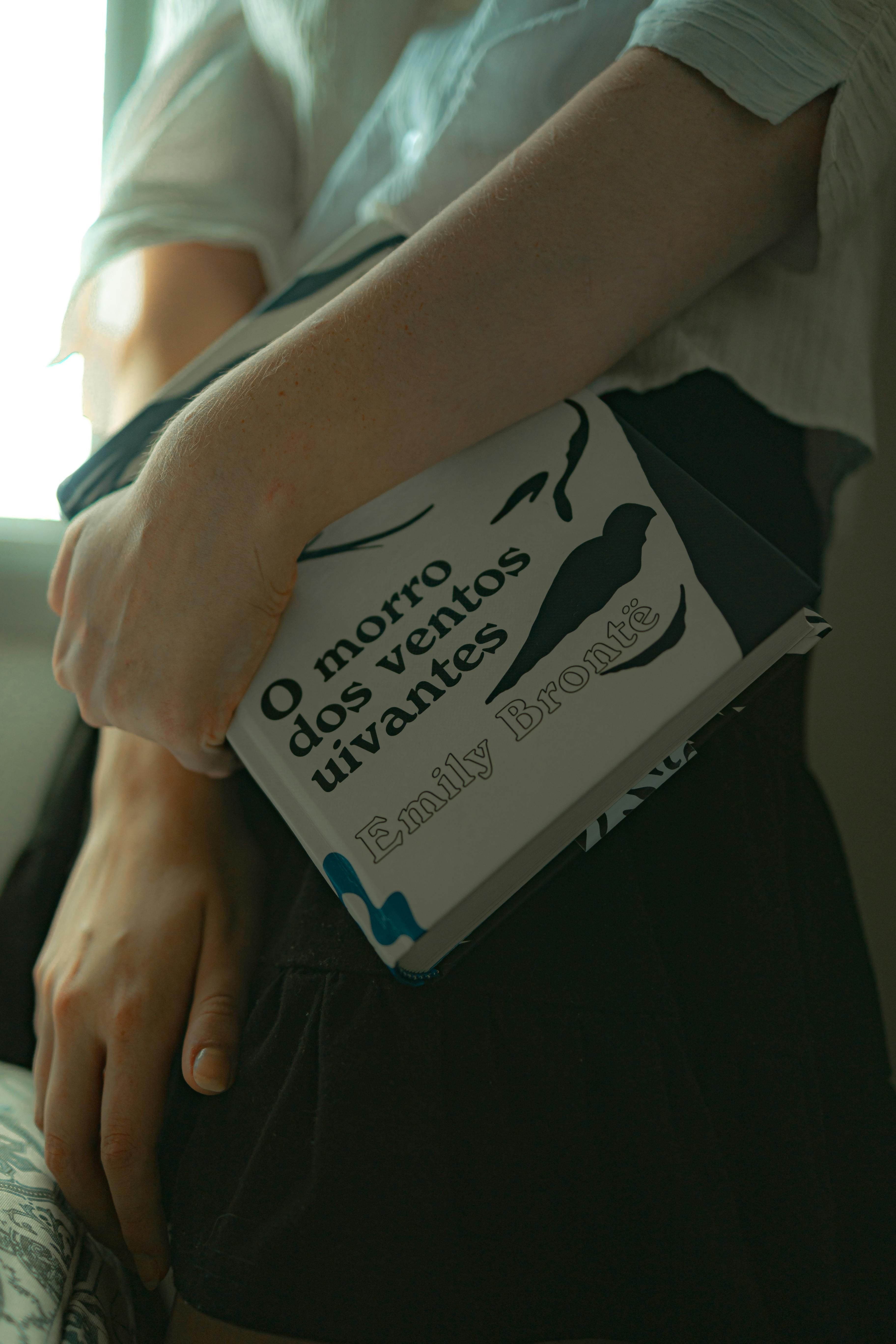 A Person Holding a Book · Free Stock Photo