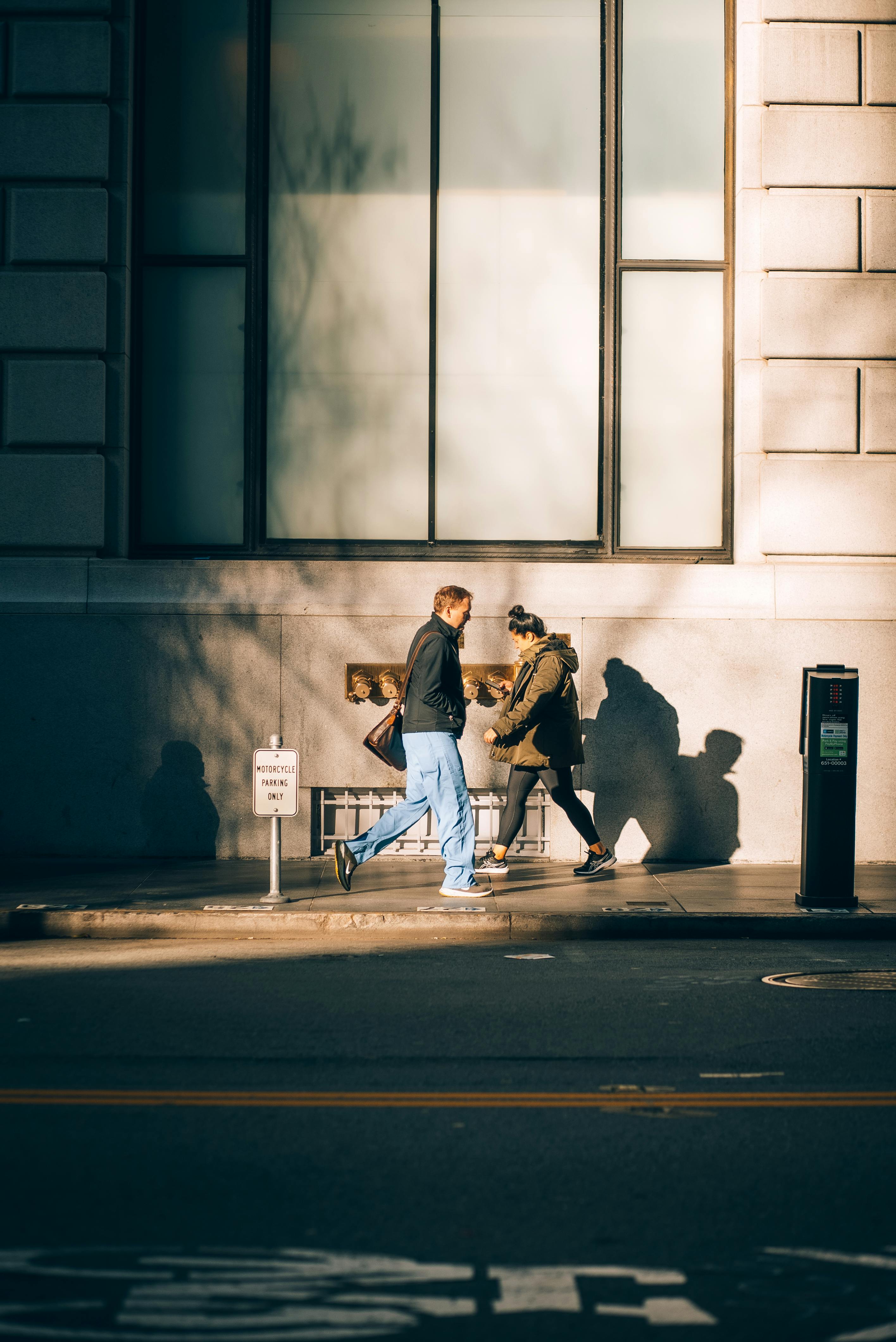 Grayscale Photography of People Walking Near Buildings · Free Stock Photo