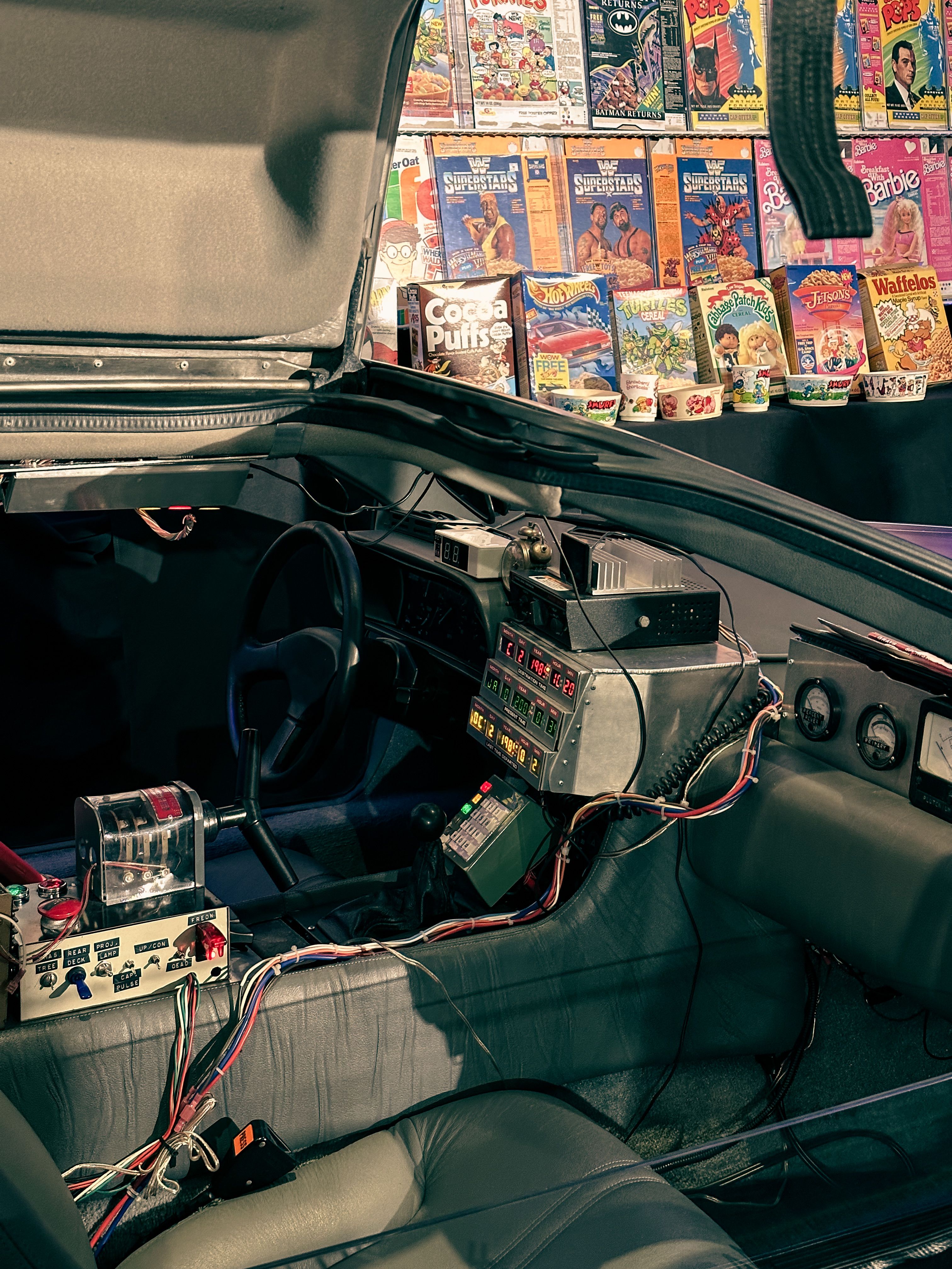 Exhibition of Car Interior with Magazines behind · Free Stock Photo
