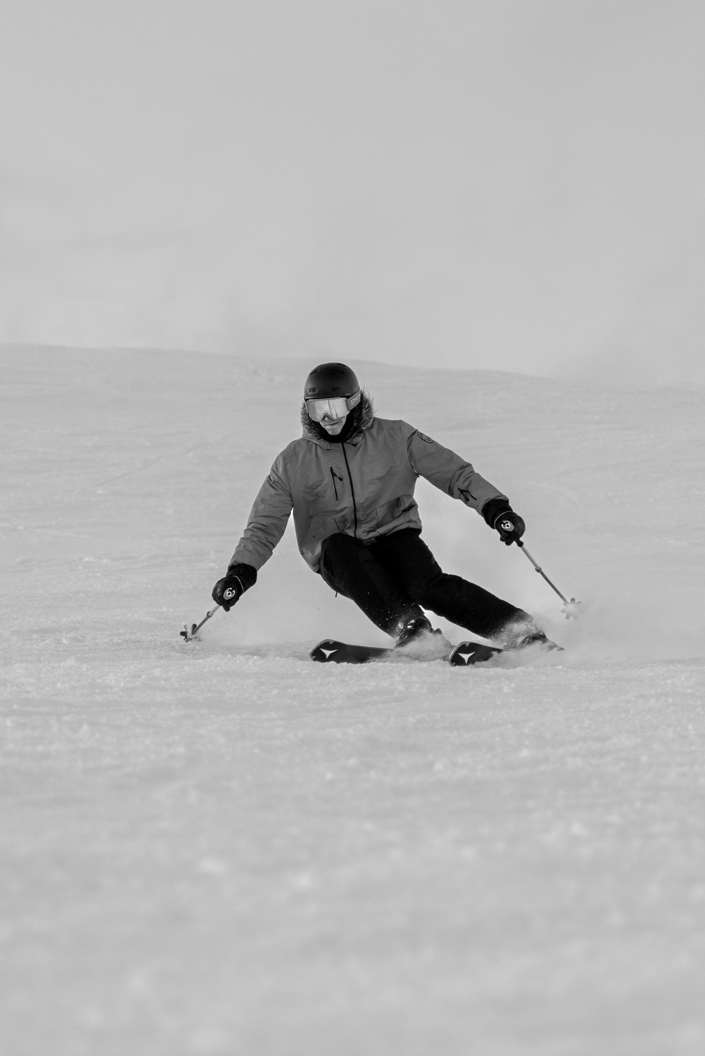Grayscale Photo of a Man Skiing · Free Stock Photo