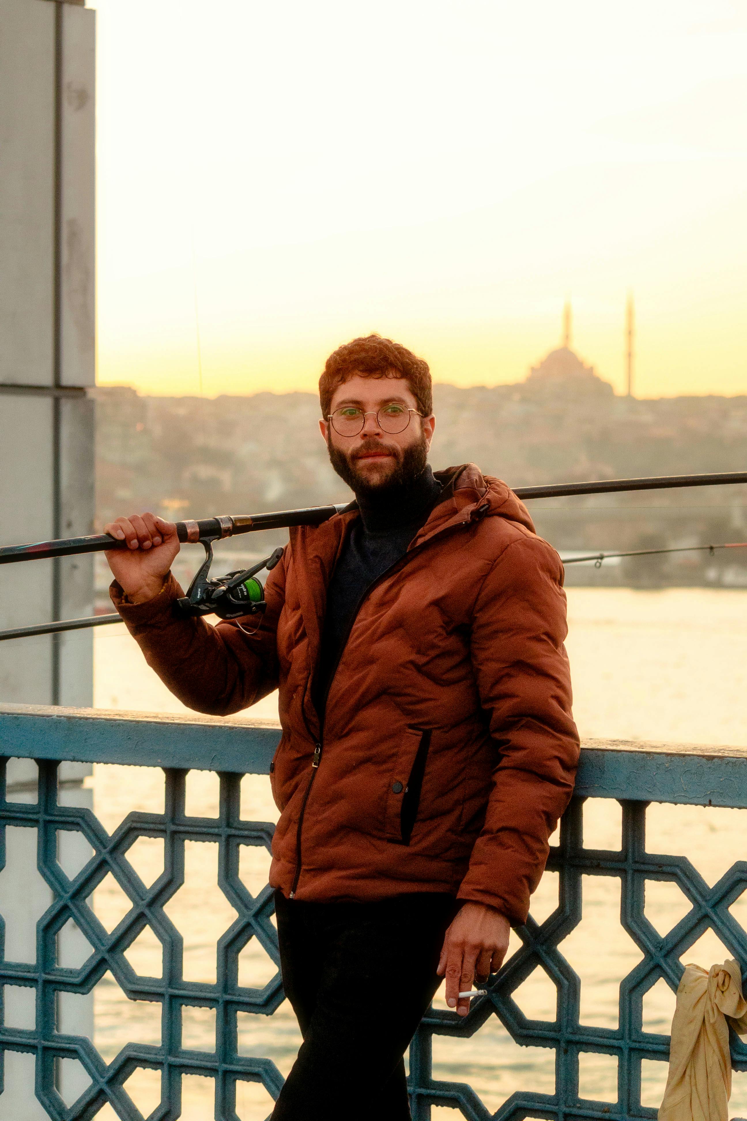 Man with a Fishing Rod Standing on the Bridge over the Bosphorus Strait ...