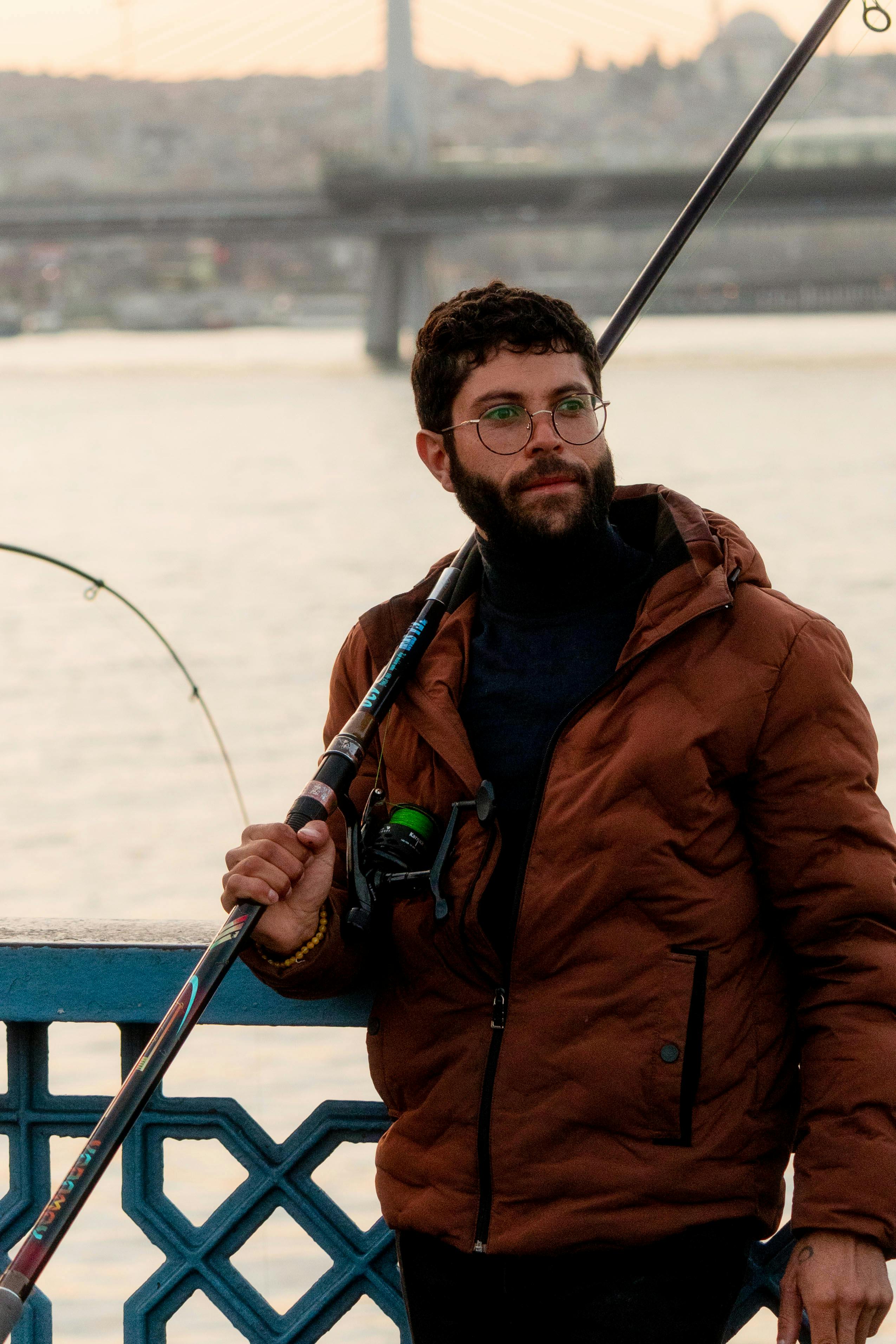 Man with a Fishing Rod Standing on the Bridge over the Bosphorus Strait ...
