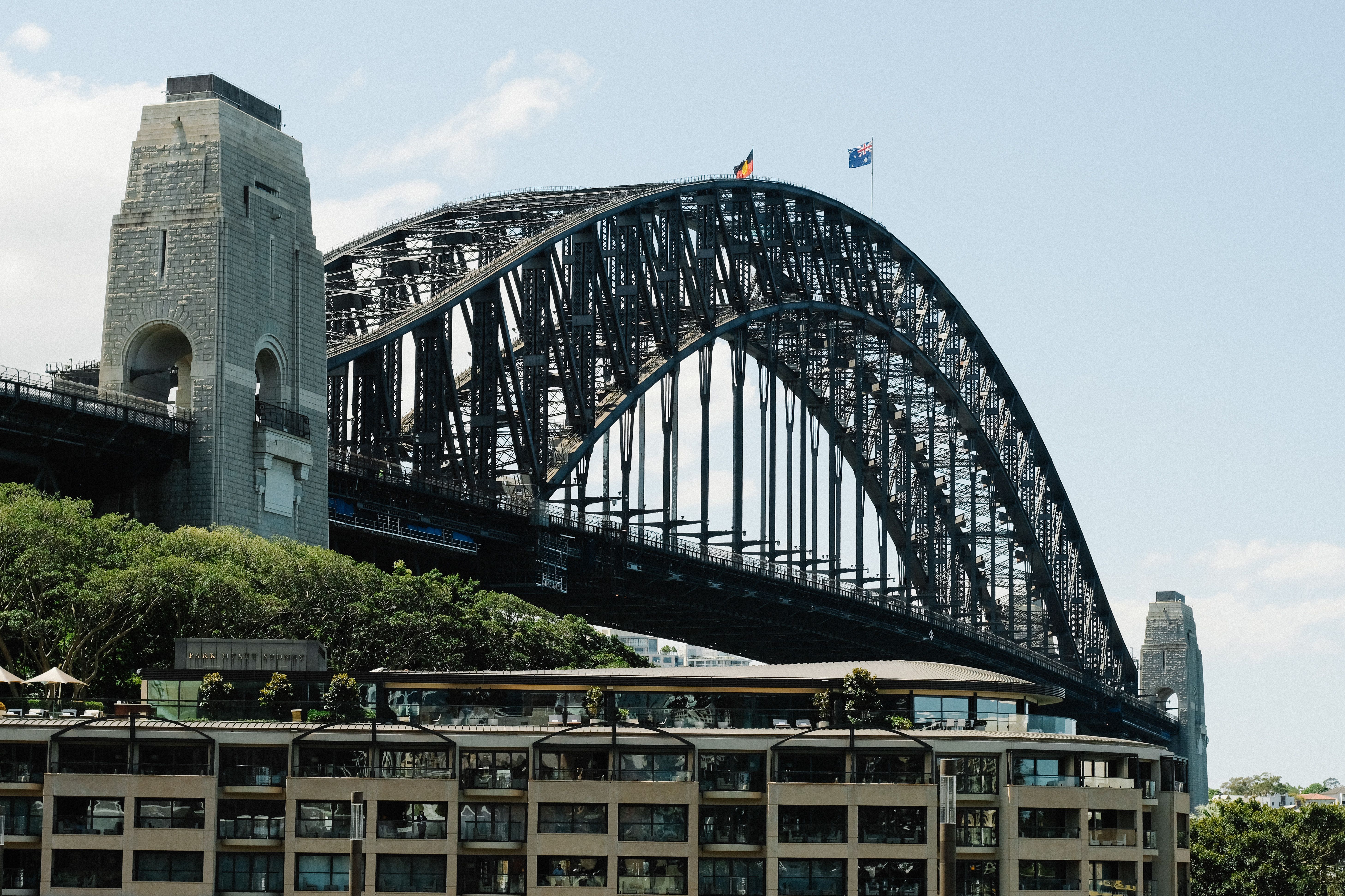 Australian flags placed on Sydney Harbor Bridge arch in twilight · Free ...