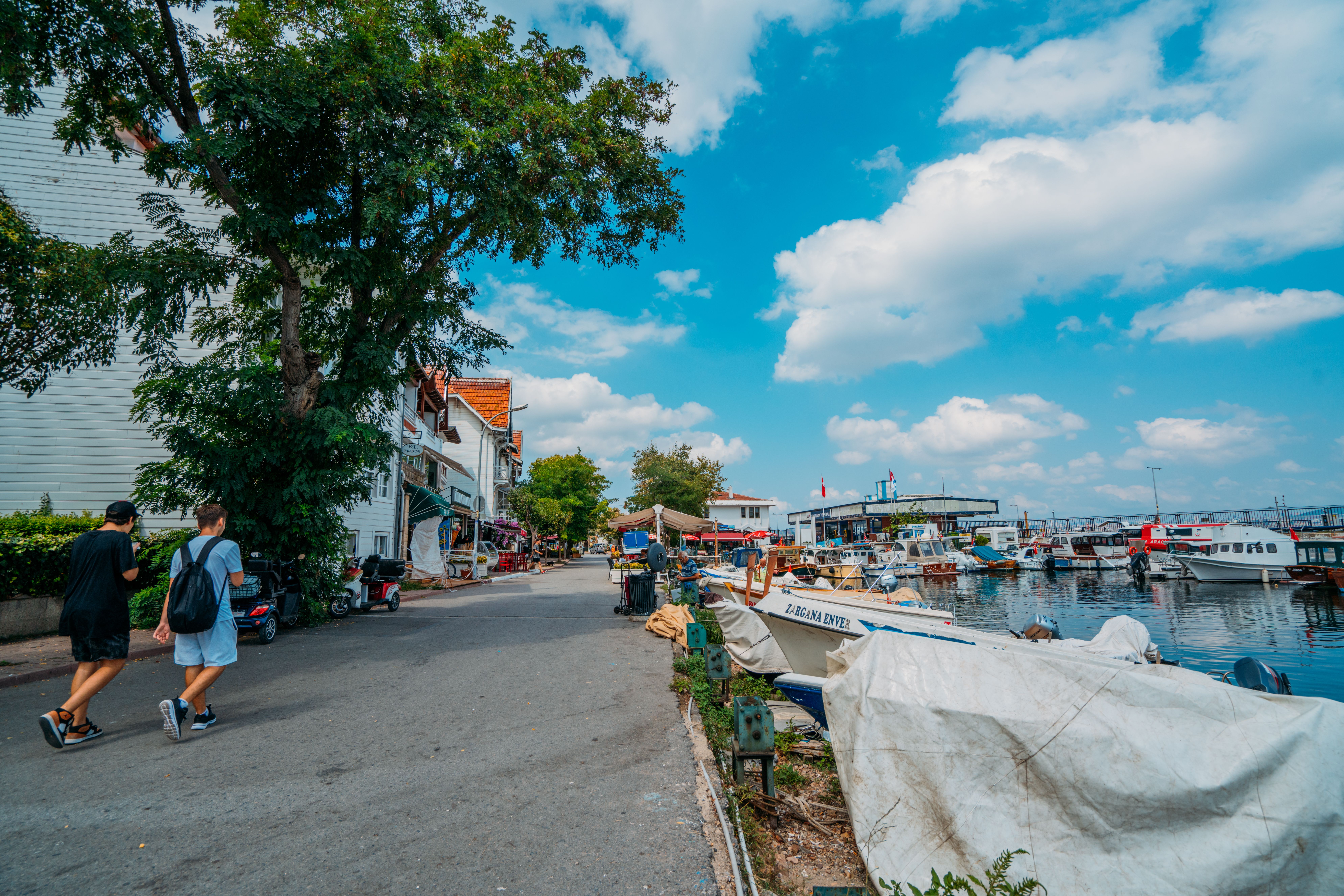 People Walking on Street near Water in Town · Free Stock Photo