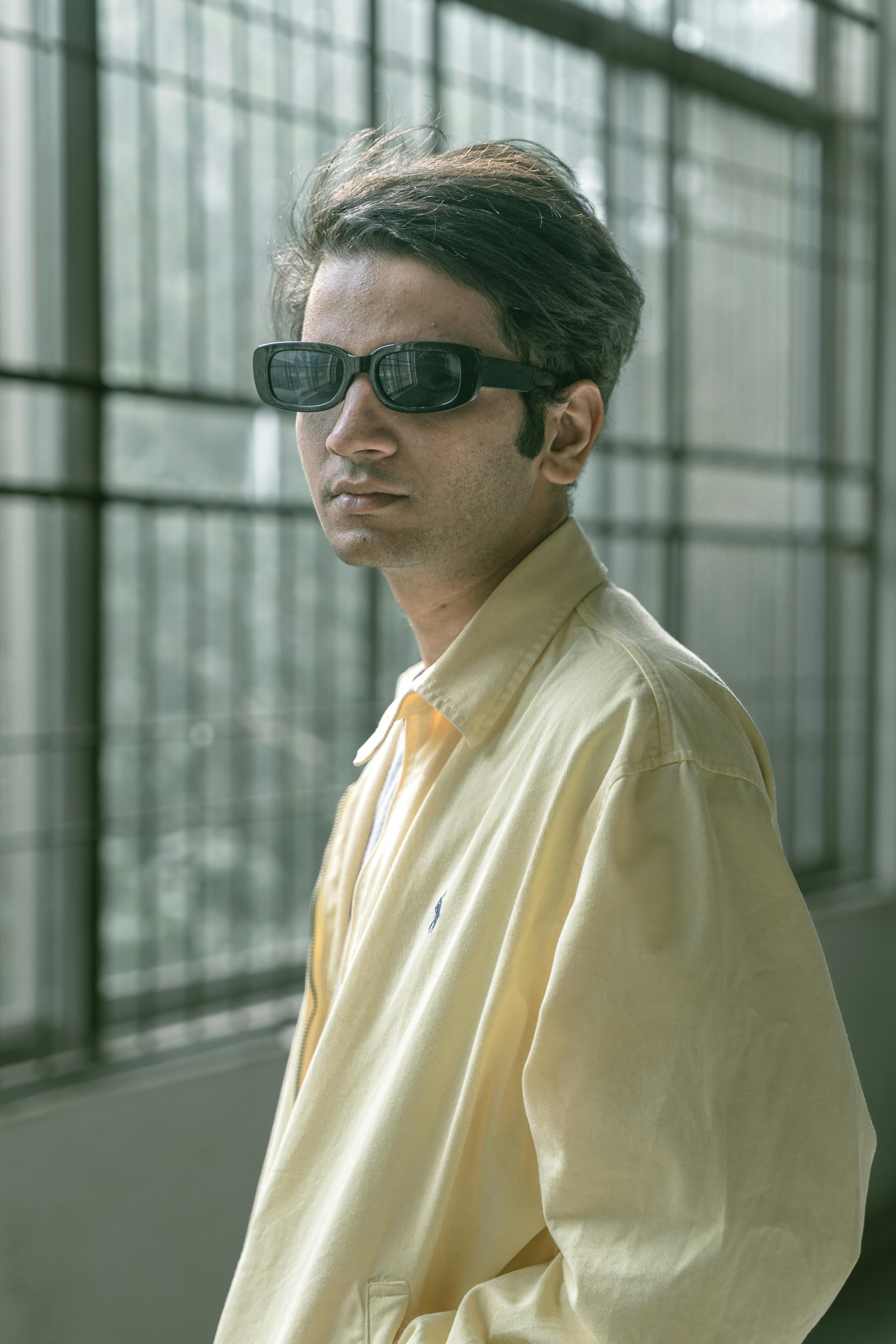 Man Posing in Yellow Shirt · Free Stock Photo