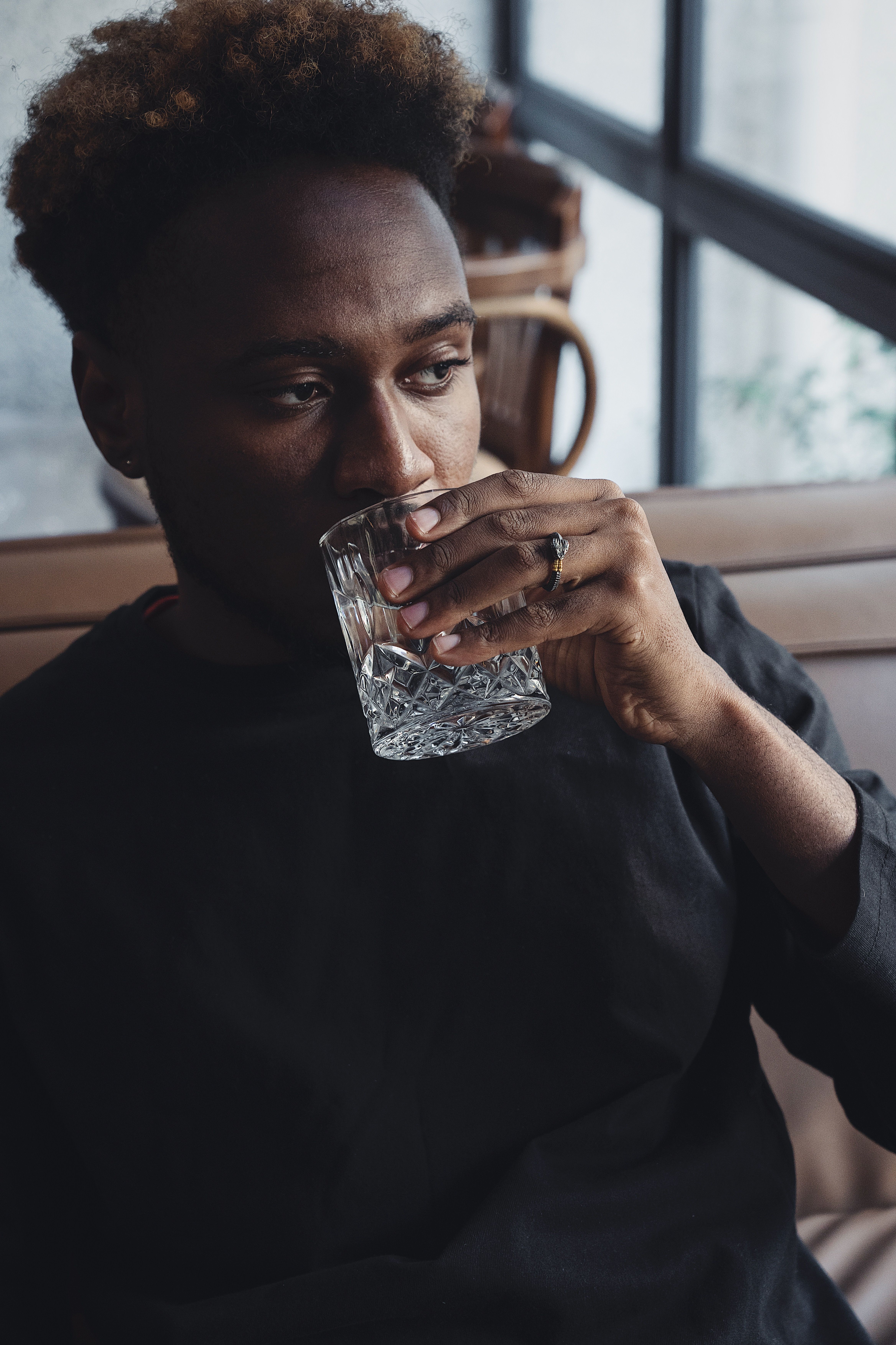 Man Wearing Snake Ring Drinking · Free Stock Photo