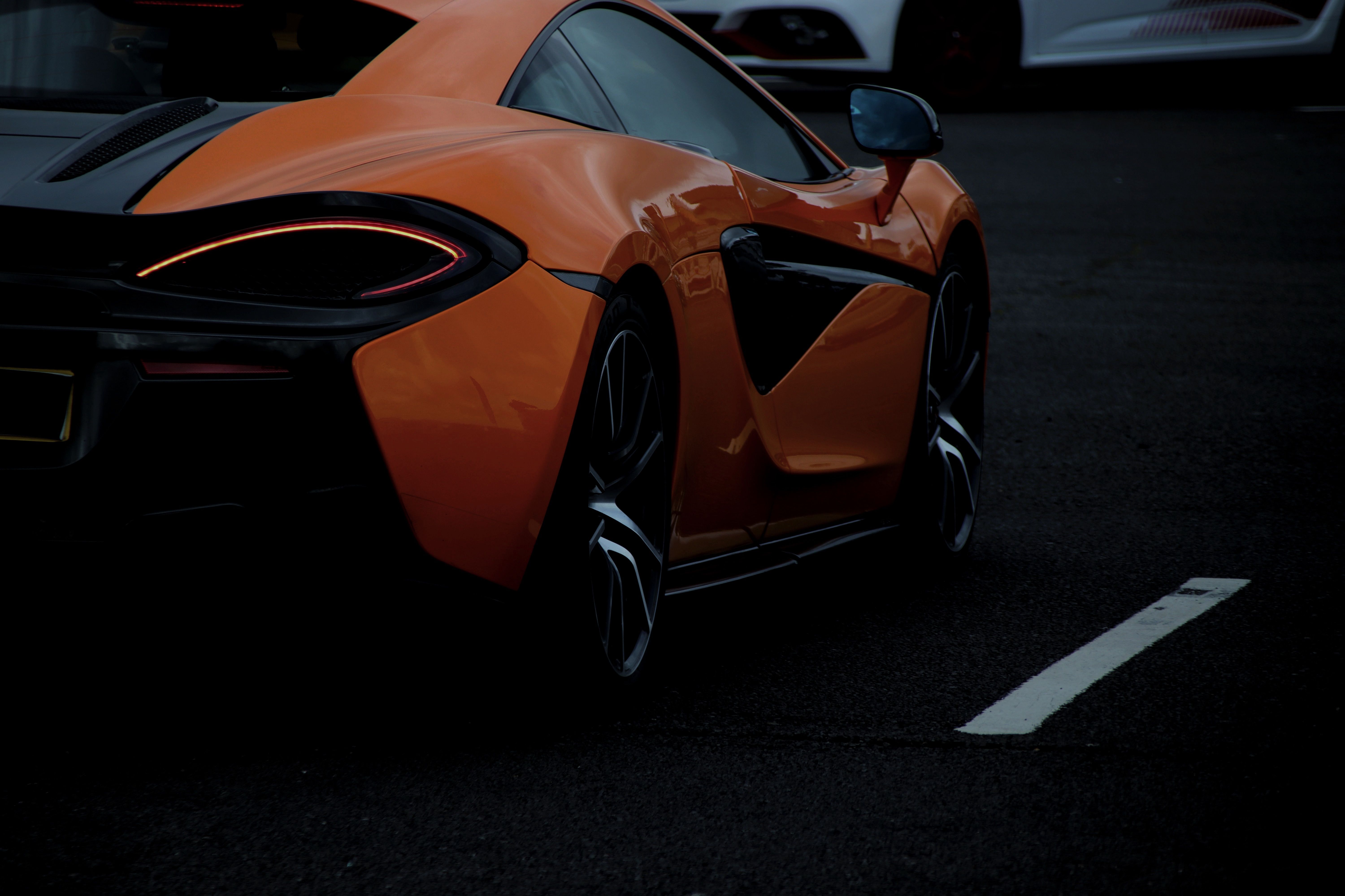 Orange McLaren 570S on Parking Lot · Free Stock Photo