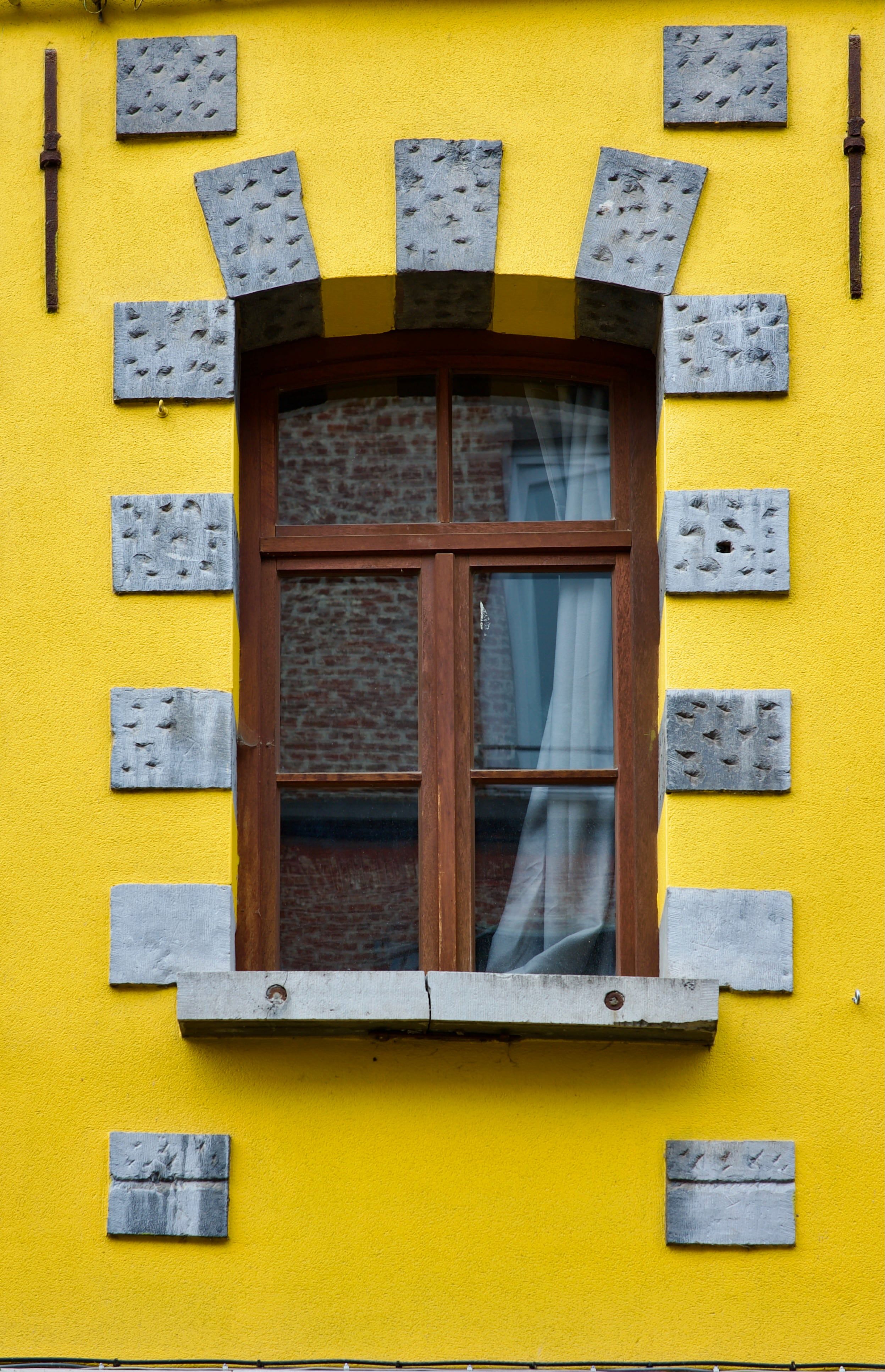 Window with a Wooden Frame in a Yellow Building · Free Stock Photo