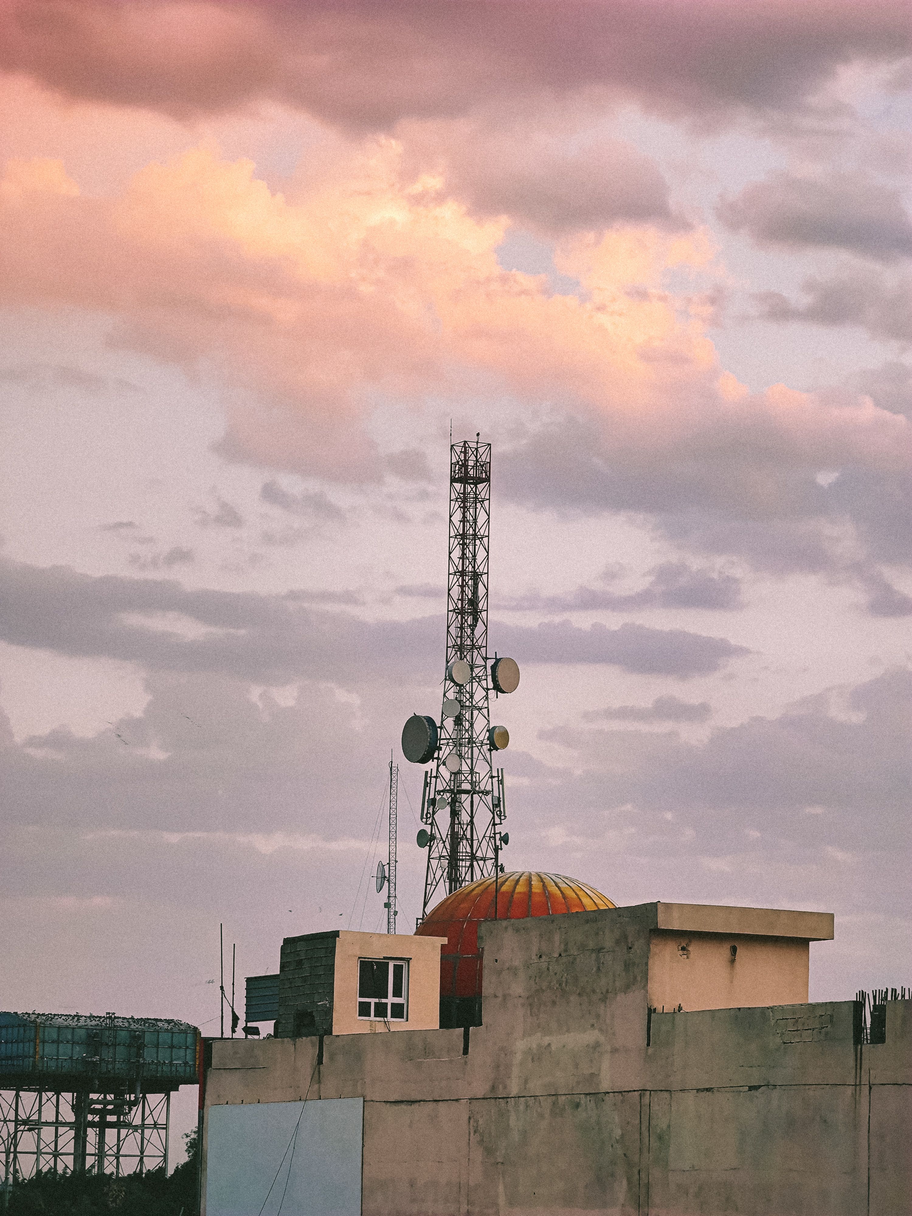 Transmission Tower on top of a Building · Free Stock Photo