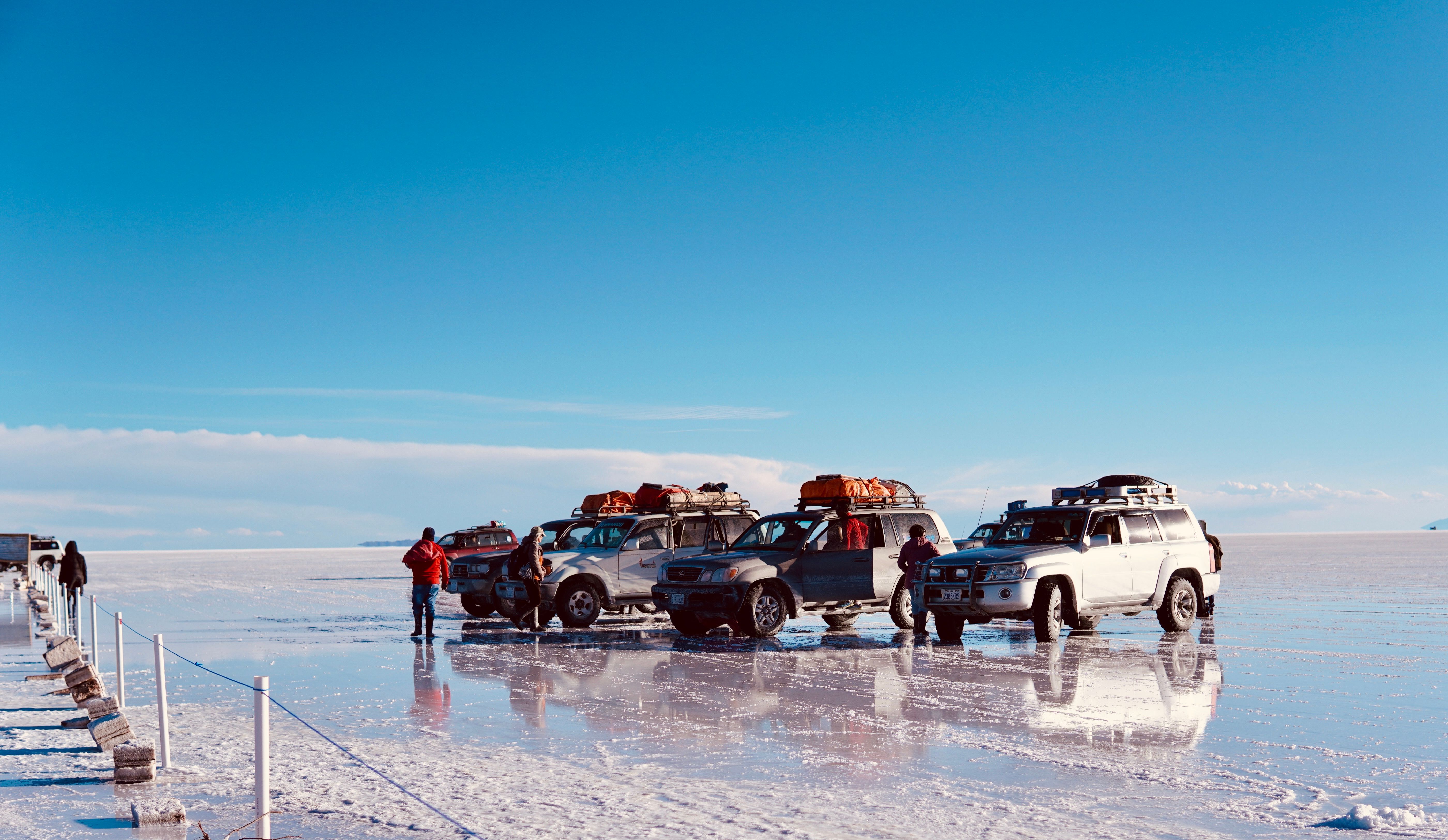 Off-Road Cars Parked in a Salt Flat · Free Stock Photo