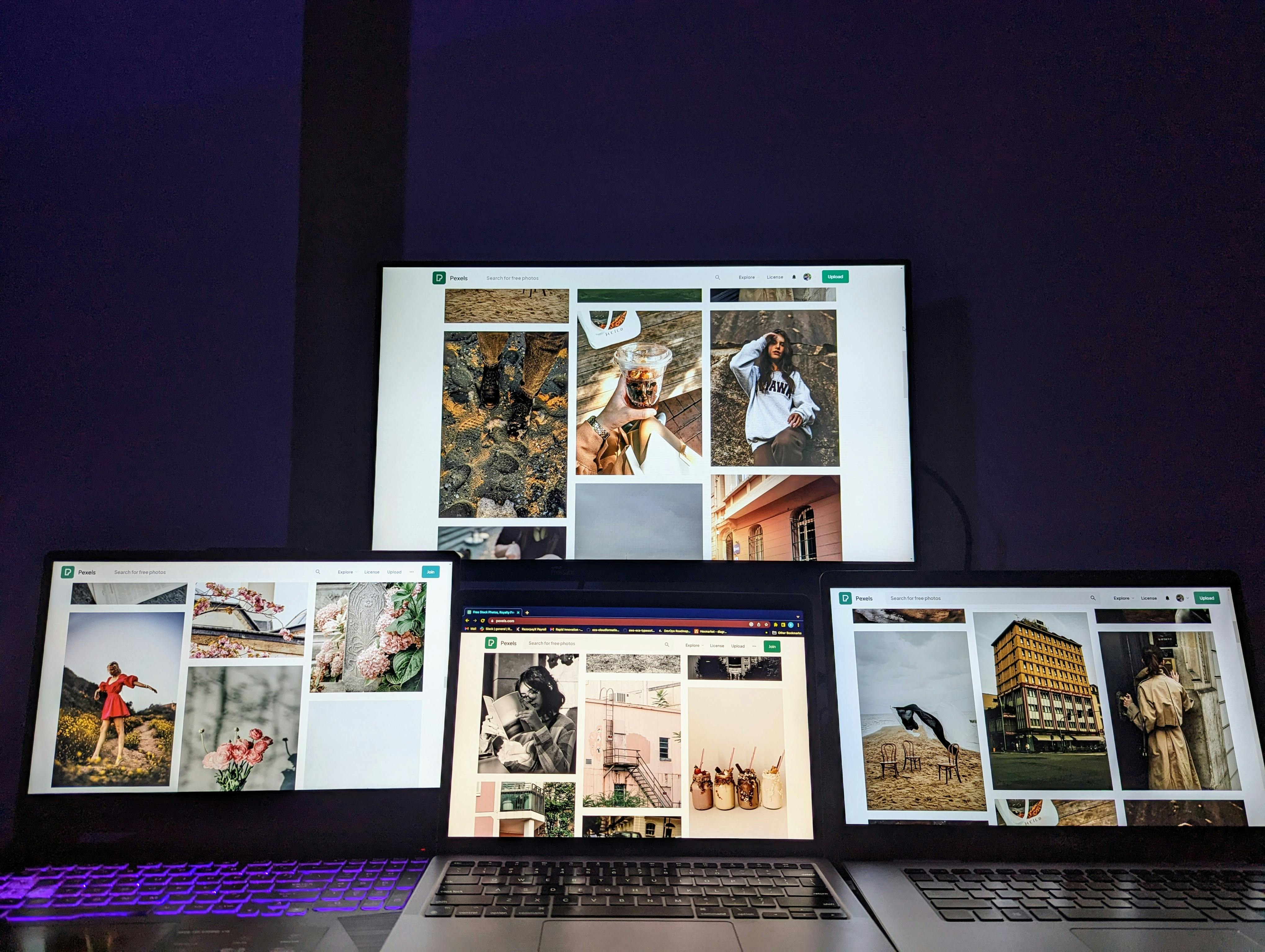 Multiple Laptops on a Desk · Free Stock Photo