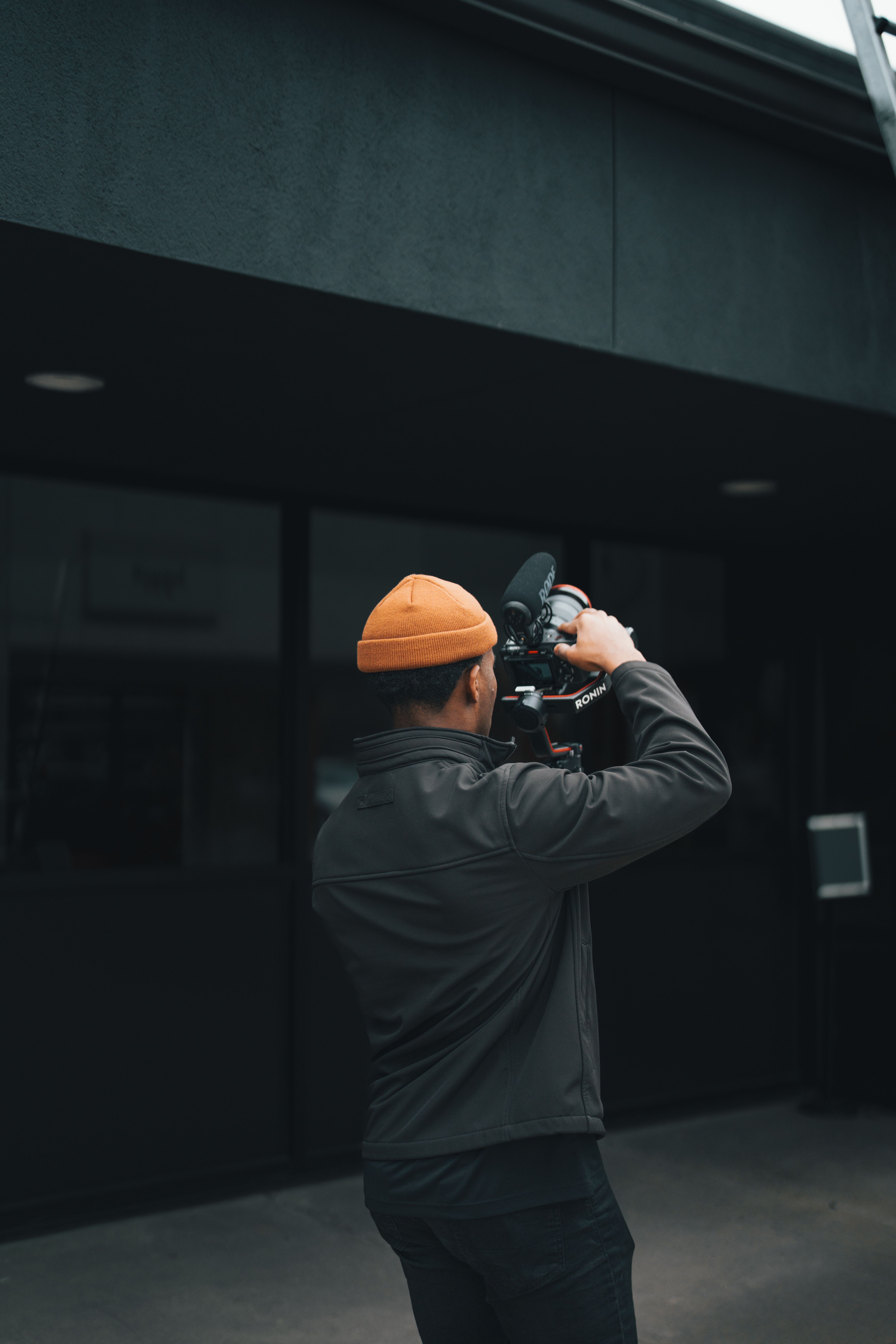 Man Filming a Video with a Professional Camera in City · Free Stock Photo