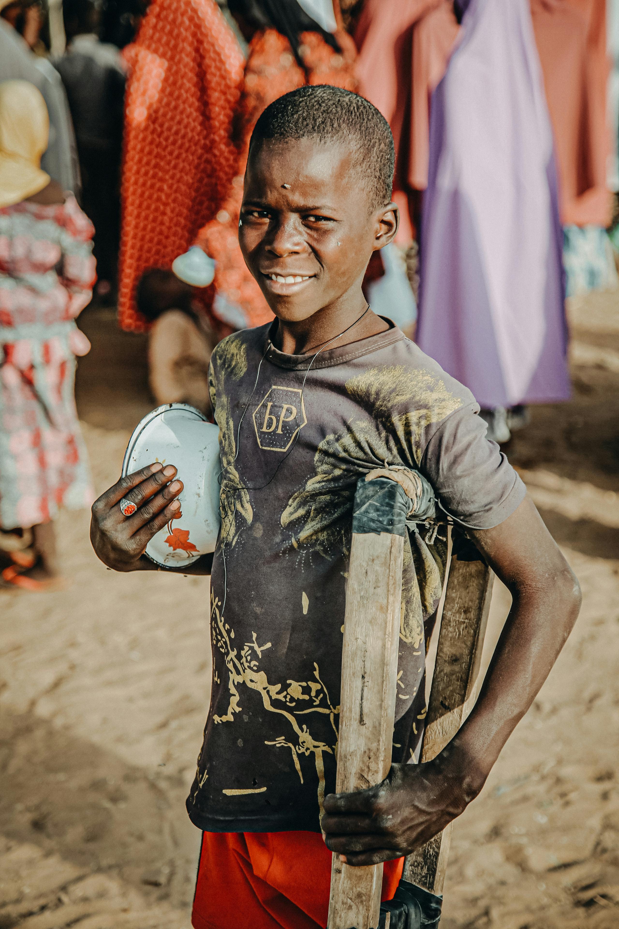 Boy Holding a Bowl · Free Stock Photo