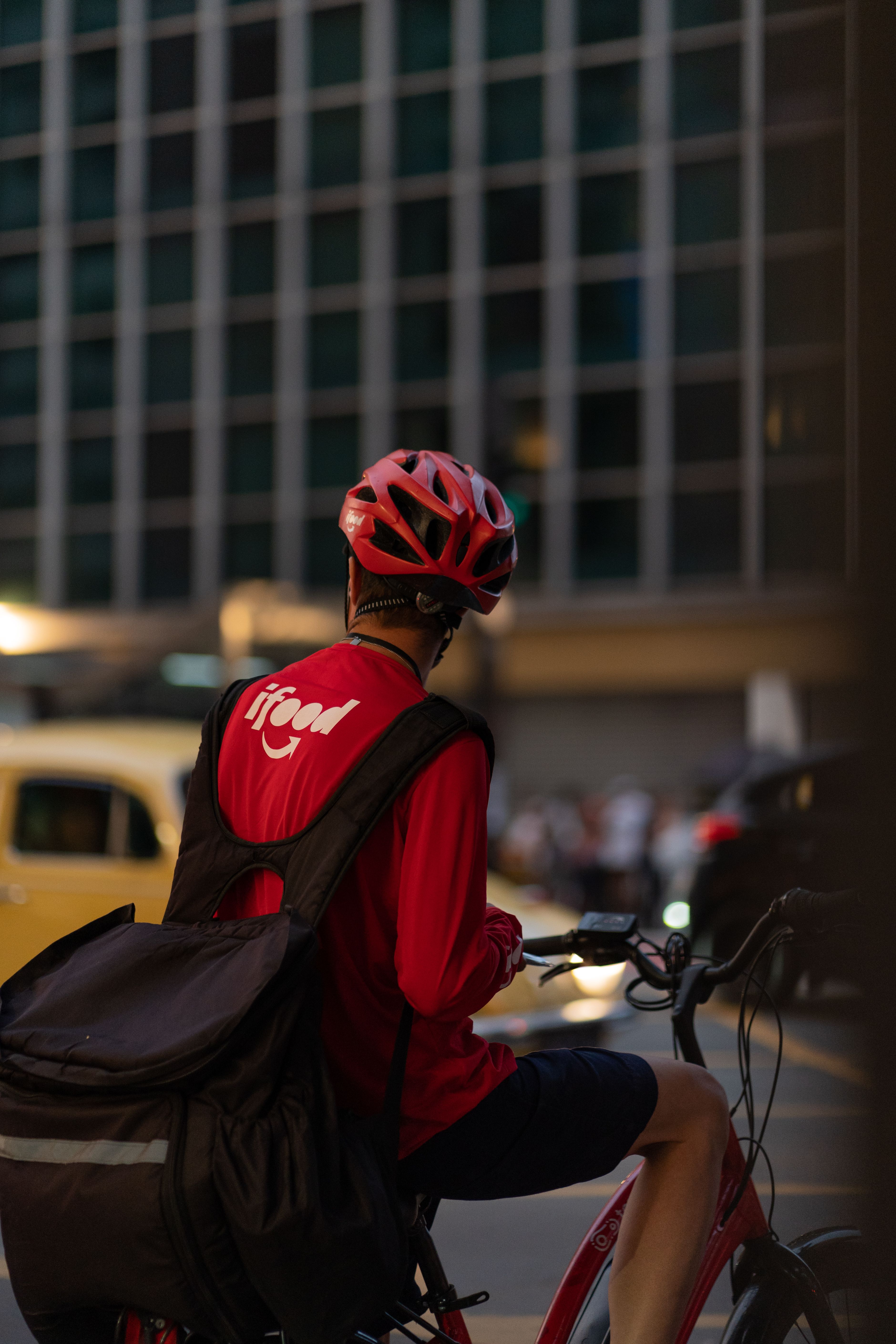 Food Delivery Driver on Bicycle · Free Stock Photo