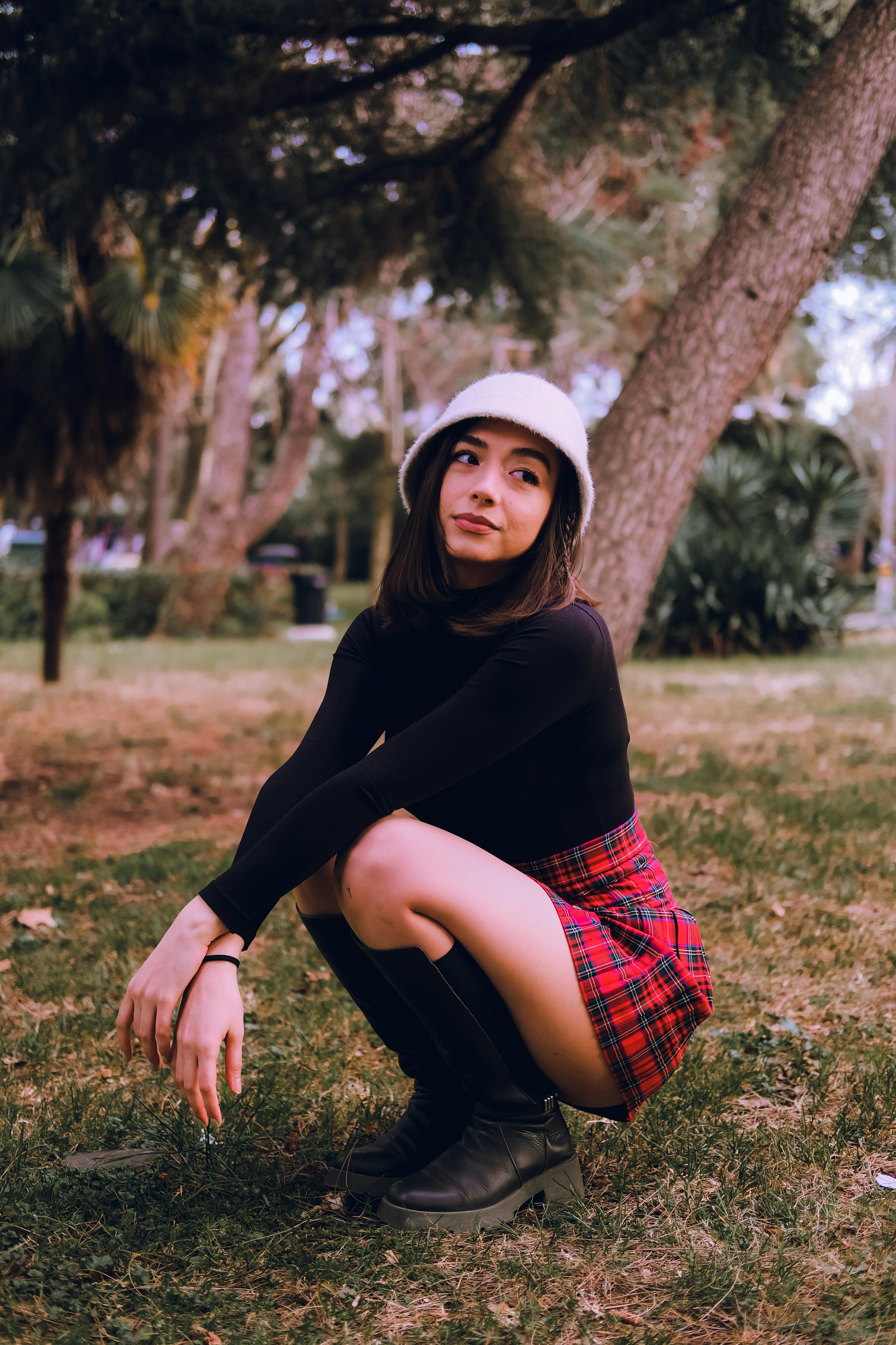 Woman Crouching and Posing · Free Stock Photo