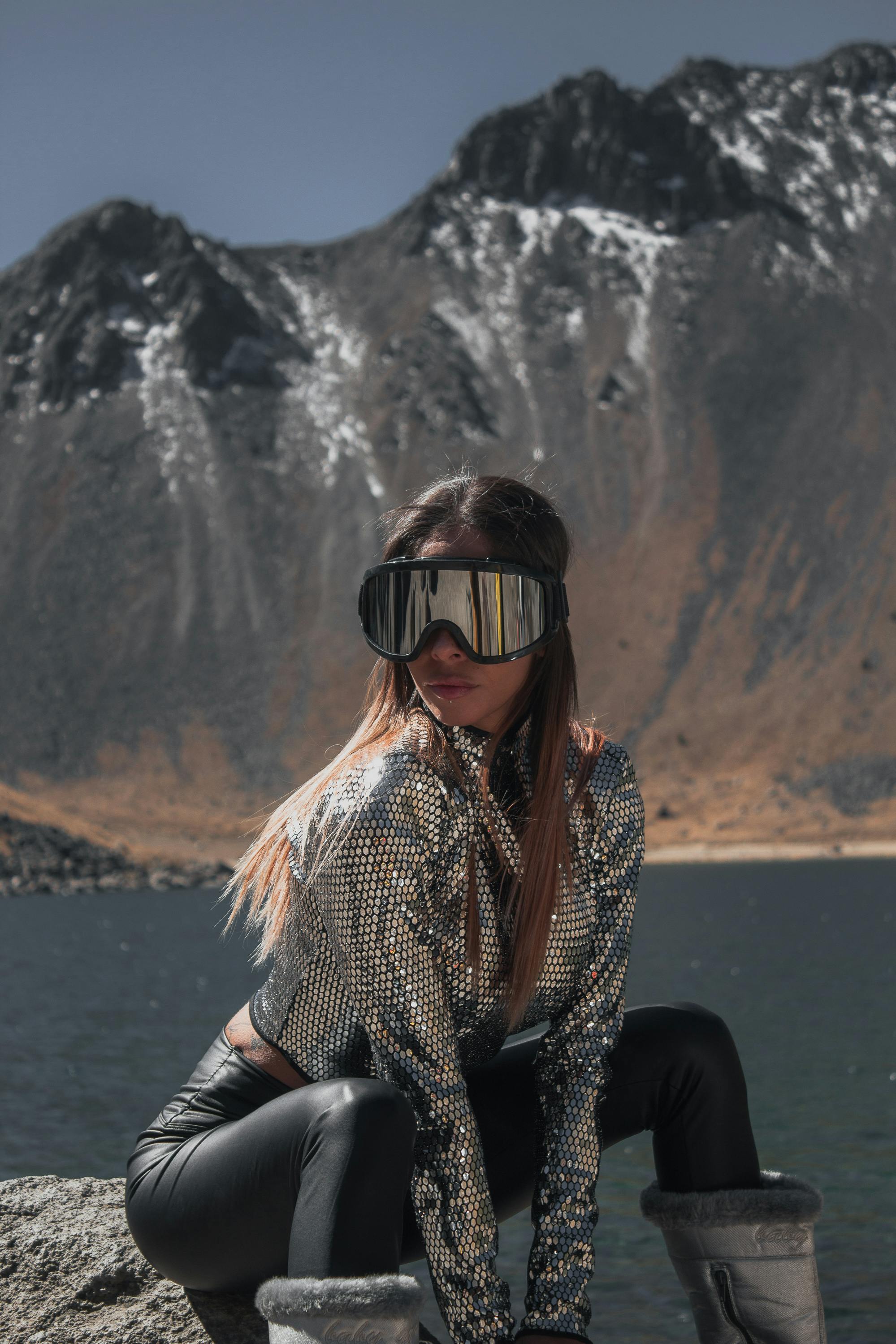 Woman Posing on Rocks over Lake · Free Stock Photo