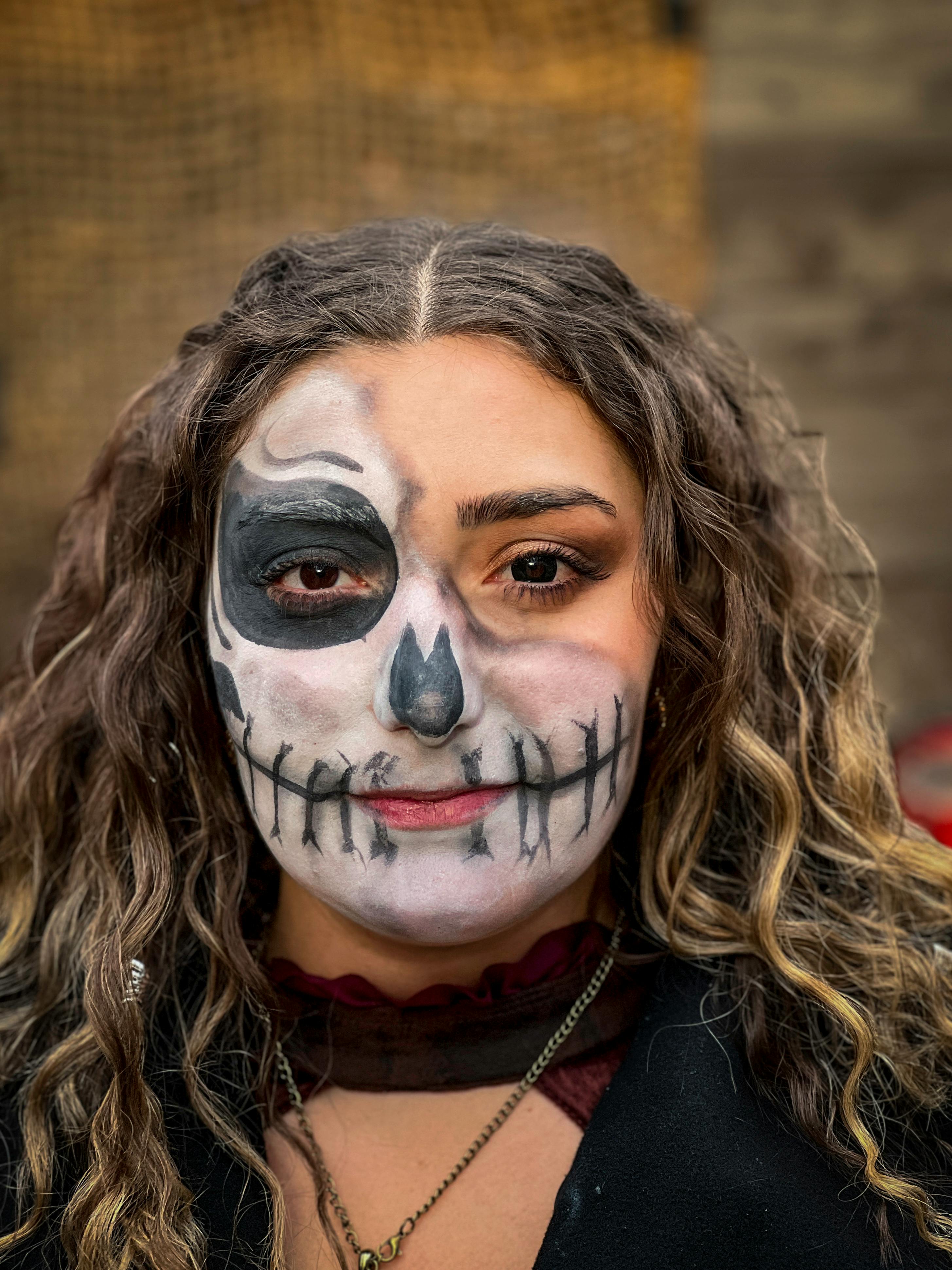 Portrait of Young Woman with Scary Painting on Face · Free Stock Photo