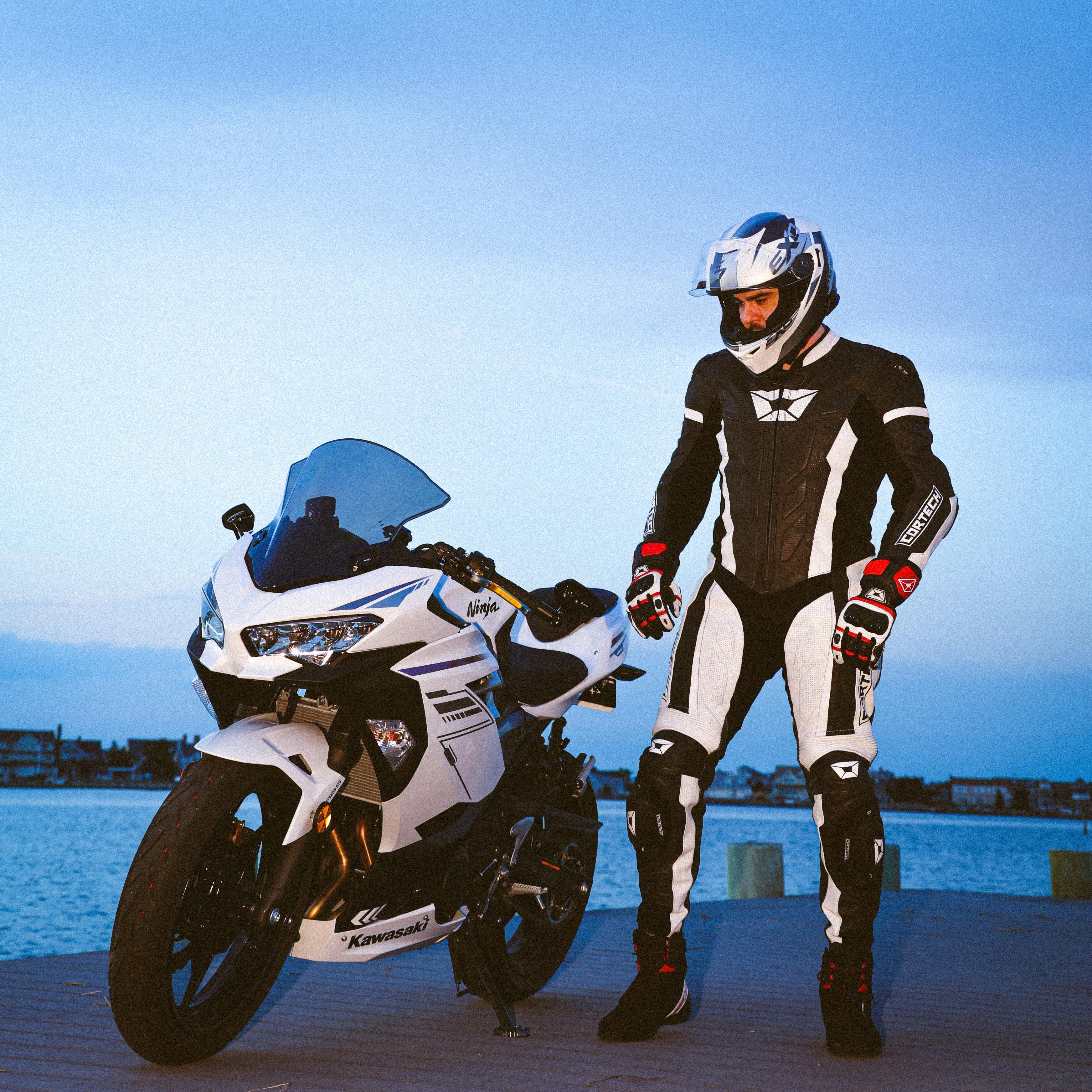 A Man Standing with a Motorcycle · Free Stock Photo