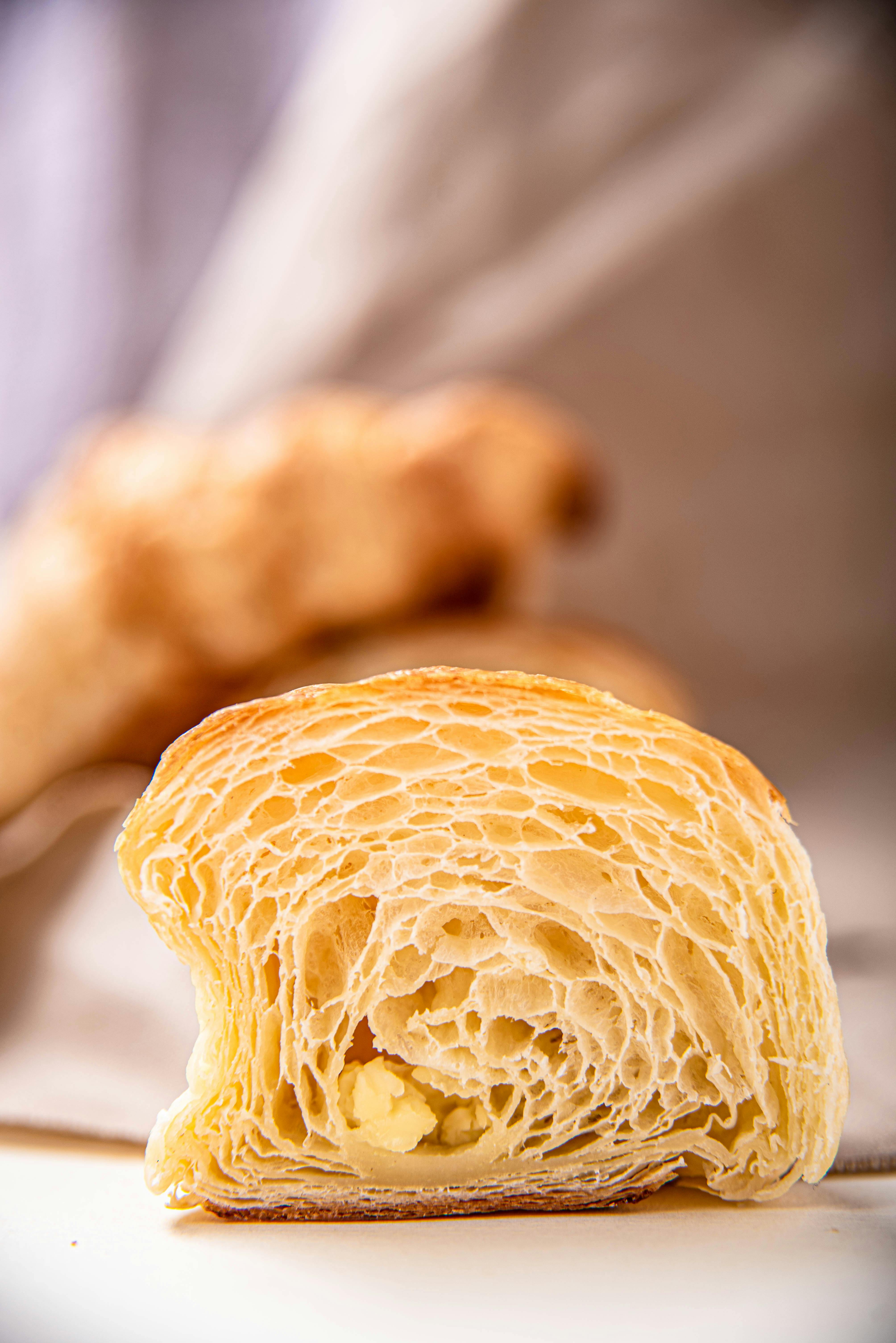 Close-up of Cut Fresh Croissant · Free Stock Photo