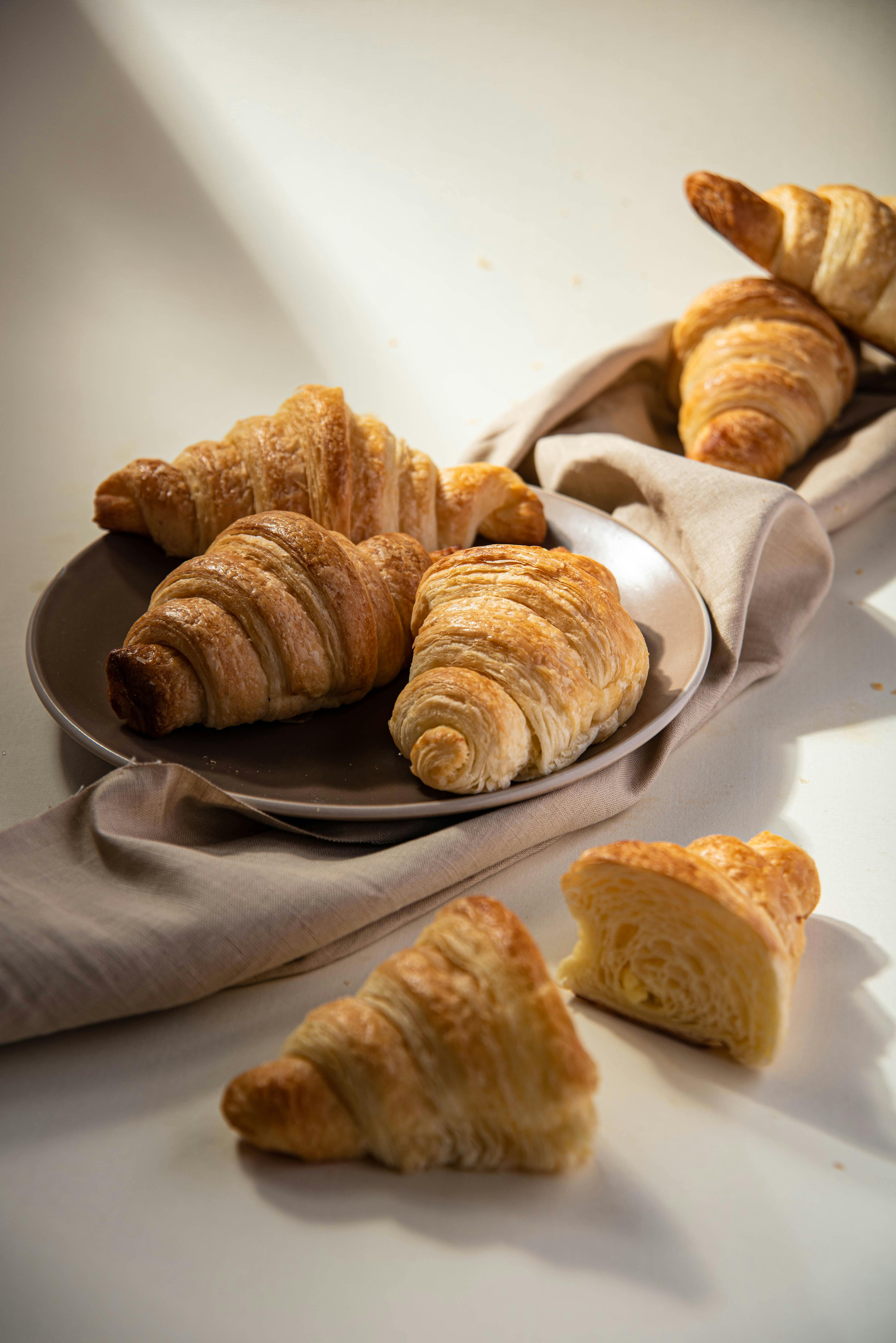 Fresh Croissants on Plate on Table · Free Stock Photo