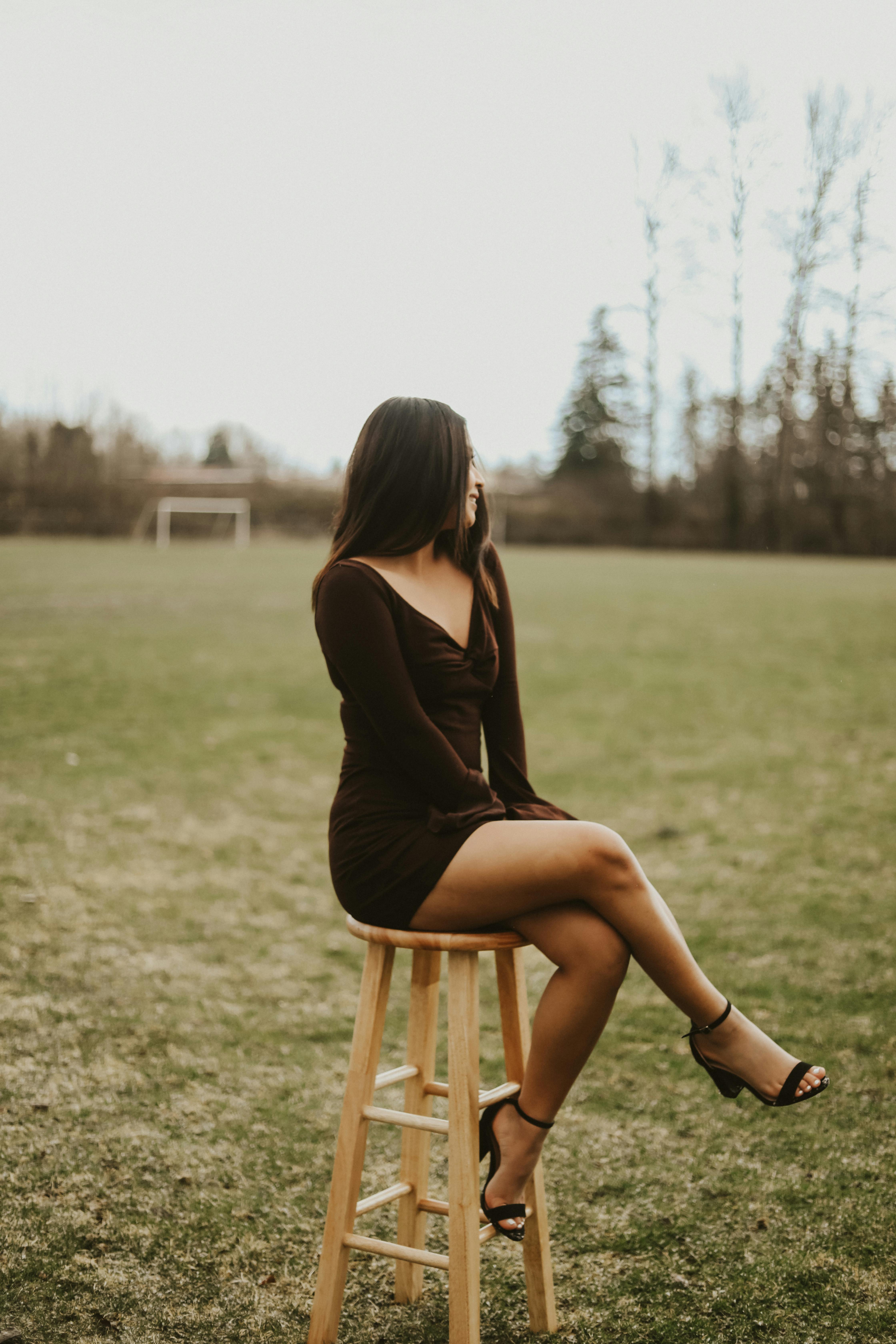 Woman Sitting on Bar Stool · Free Stock Photo