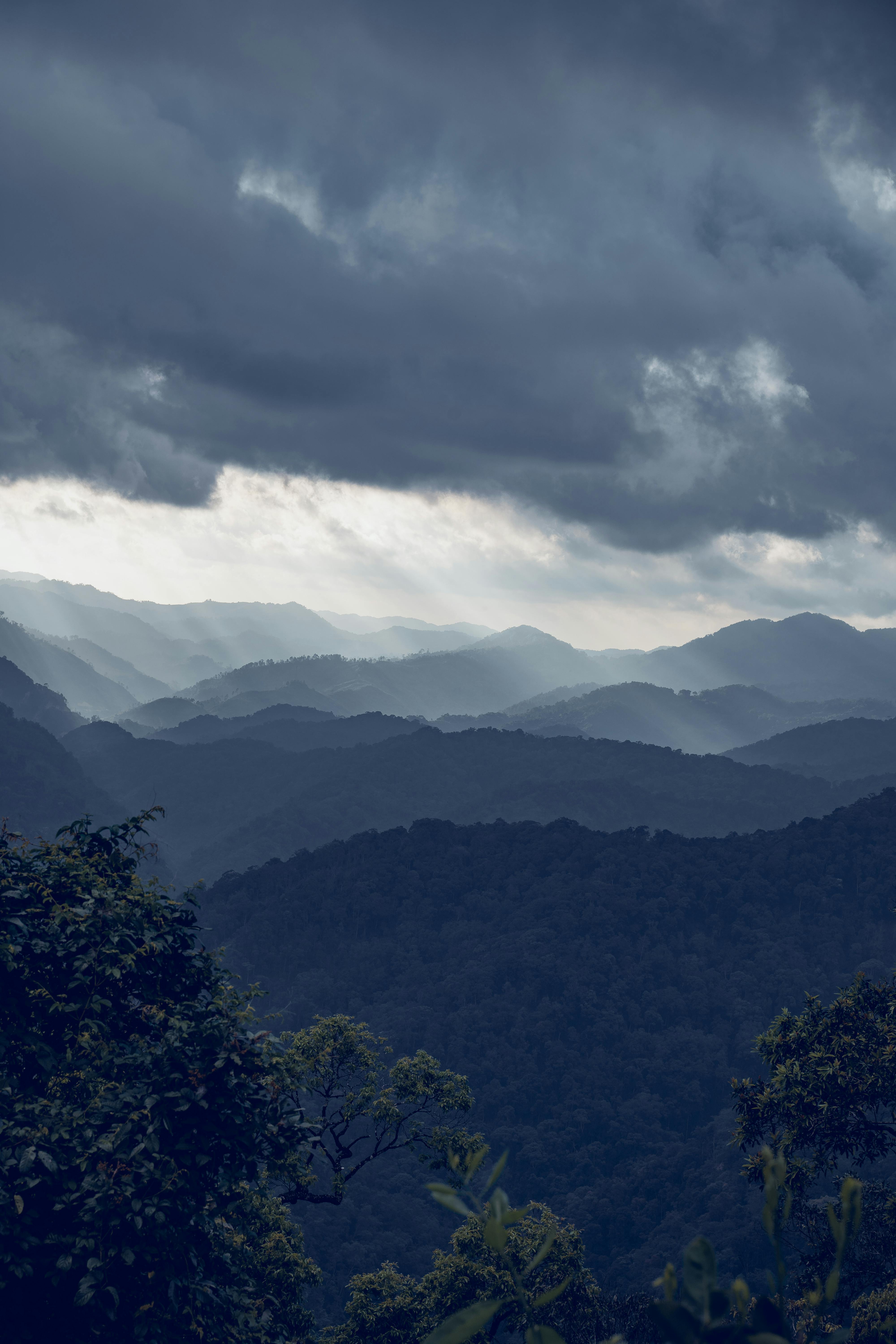 Cloudy Sky over Hills · Free Stock Photo