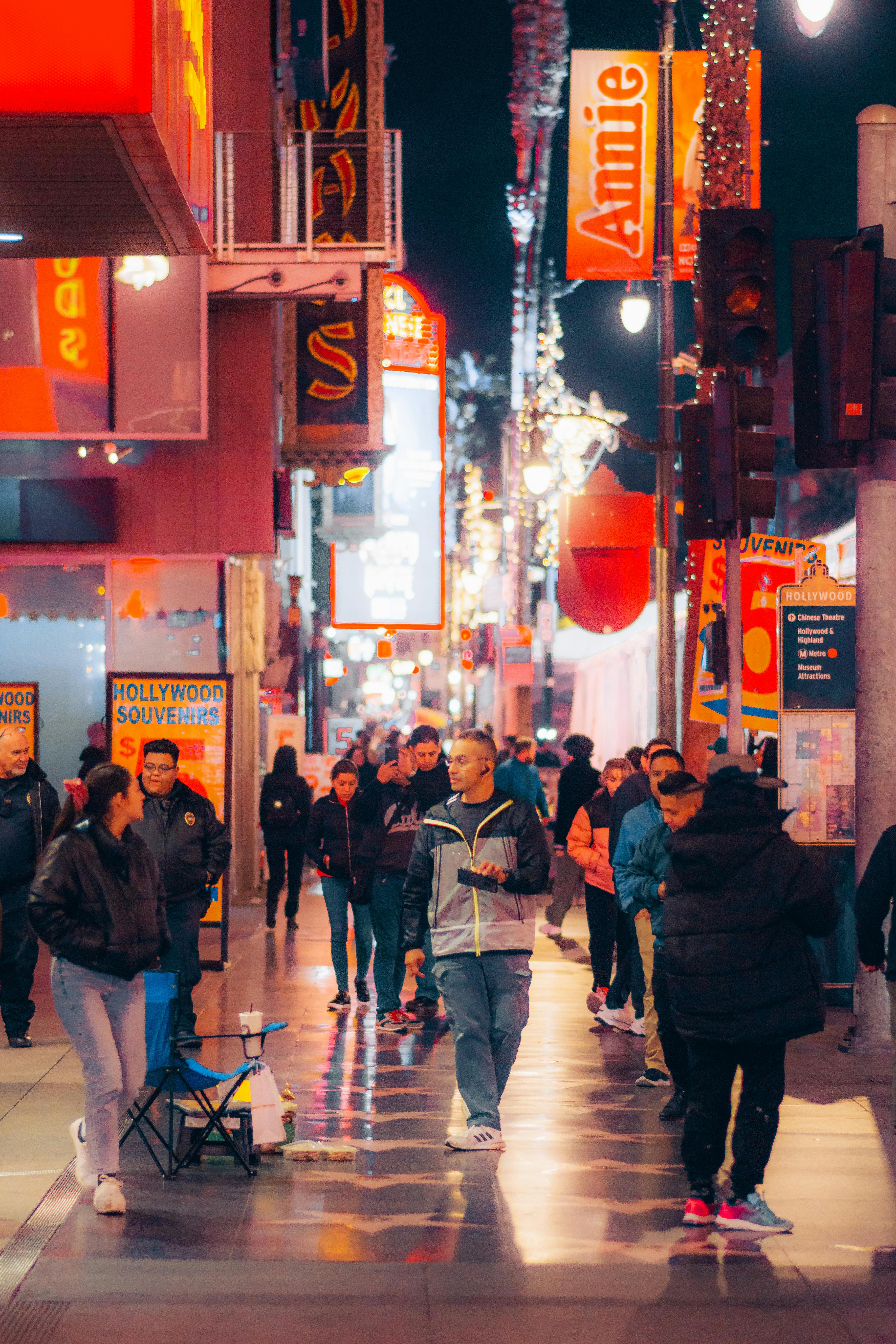 A Crowded Illuminated City Street in the Evening · Free Stock Photo