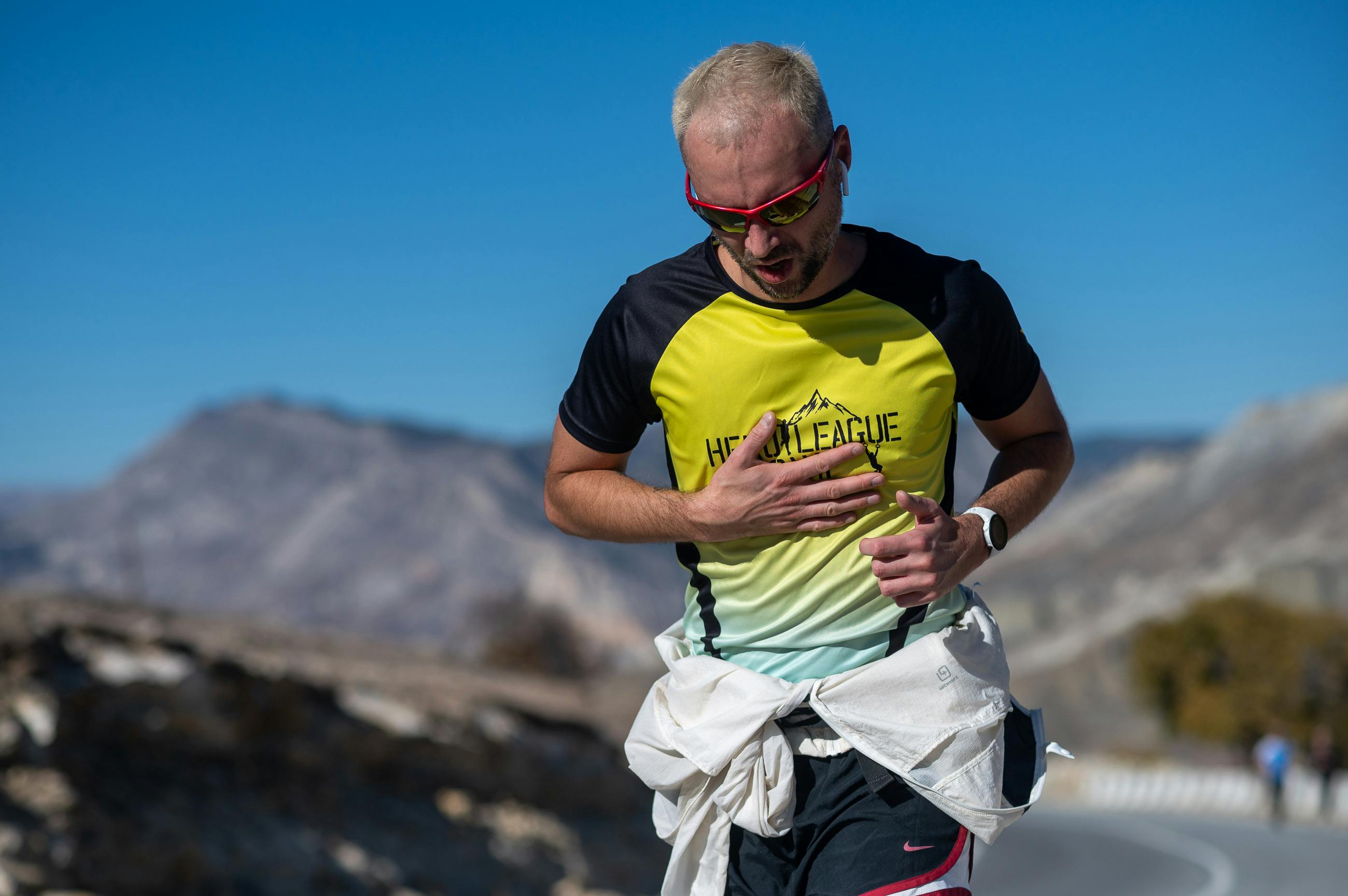 Man Running on Hills over Plains at Sunset · Free Stock Photo